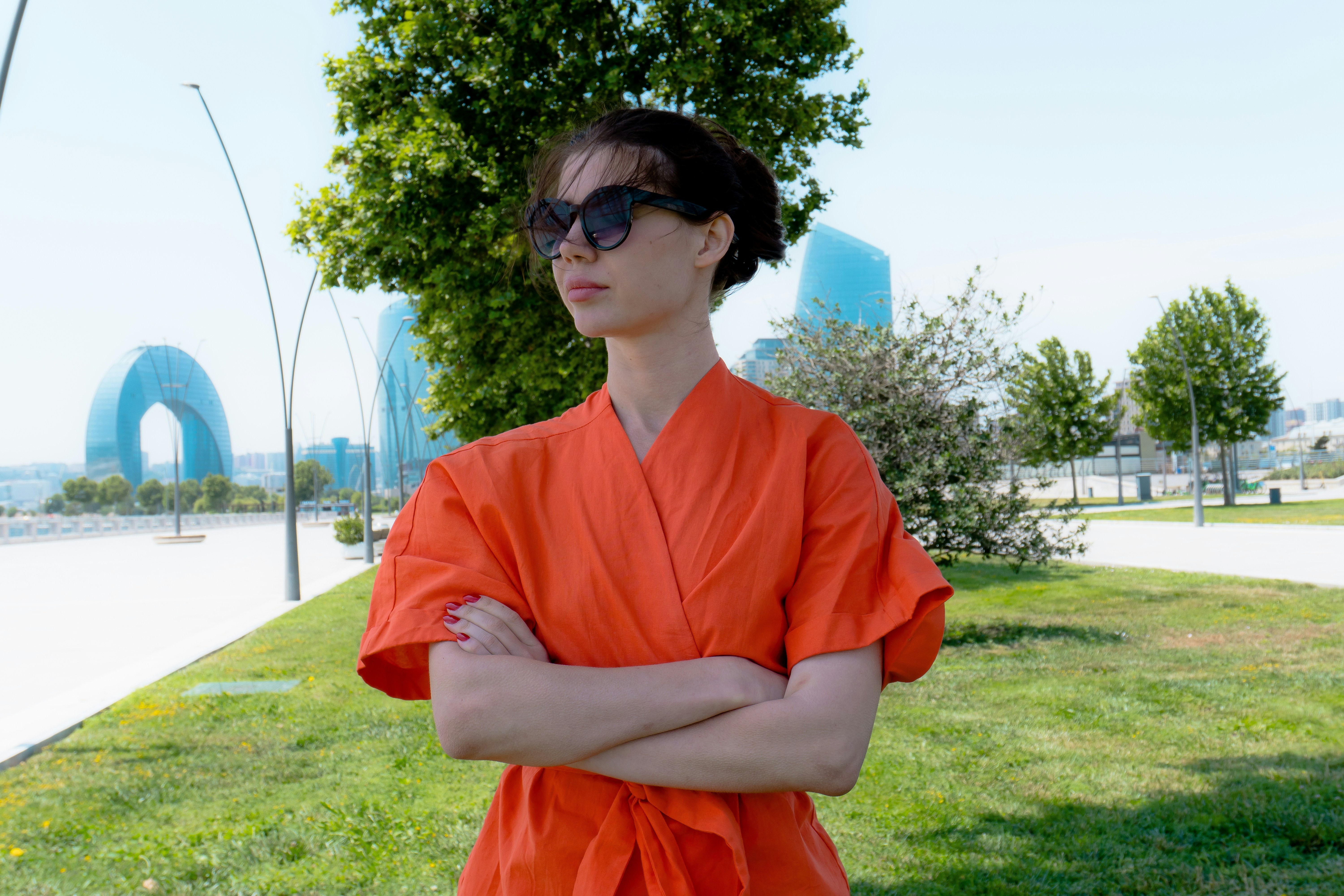 Orange Coif, Green Meadow: A Confident Moment in Modern Park