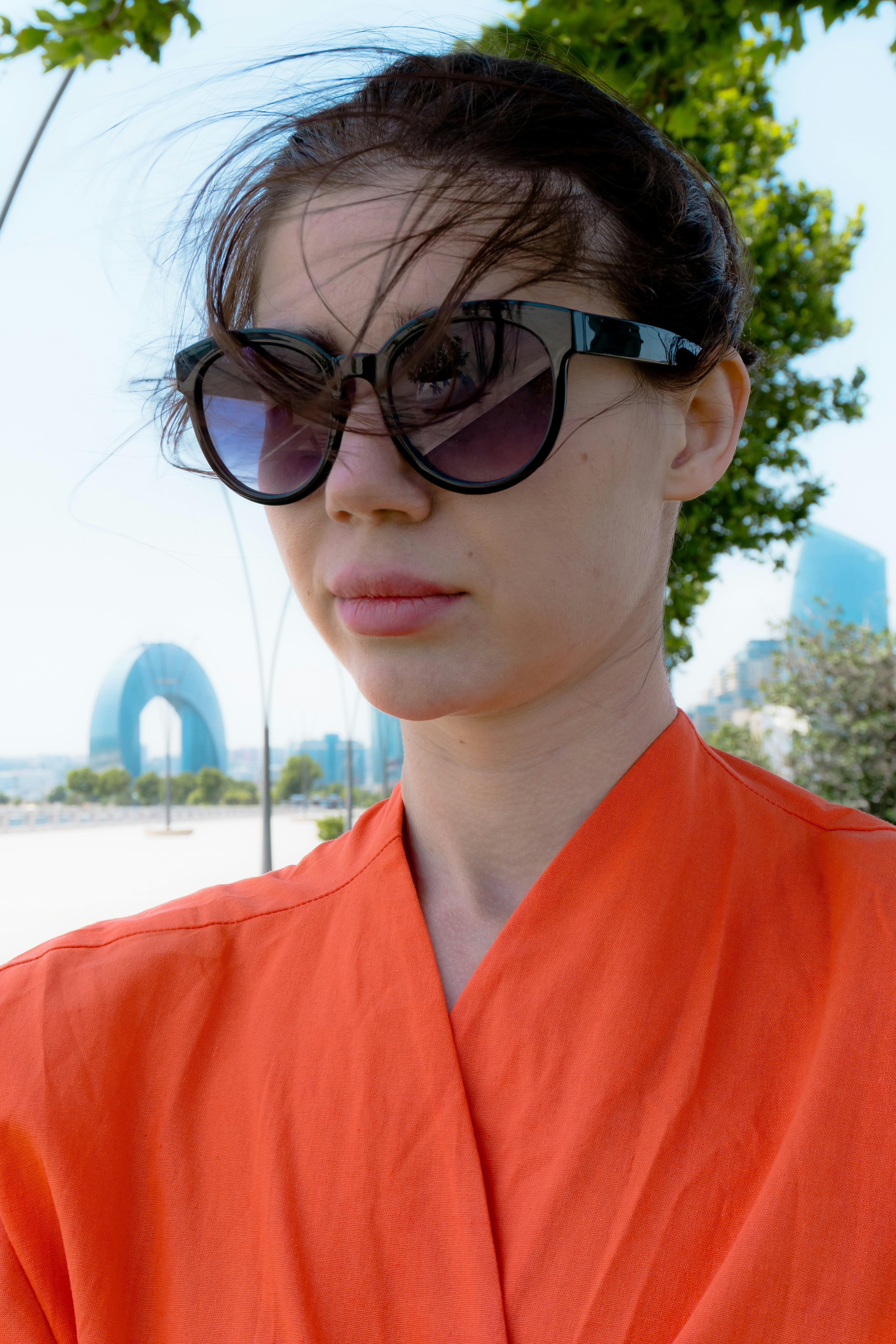 Orange Silhouette: Portrait at the Waterfront with a Blue Arch
