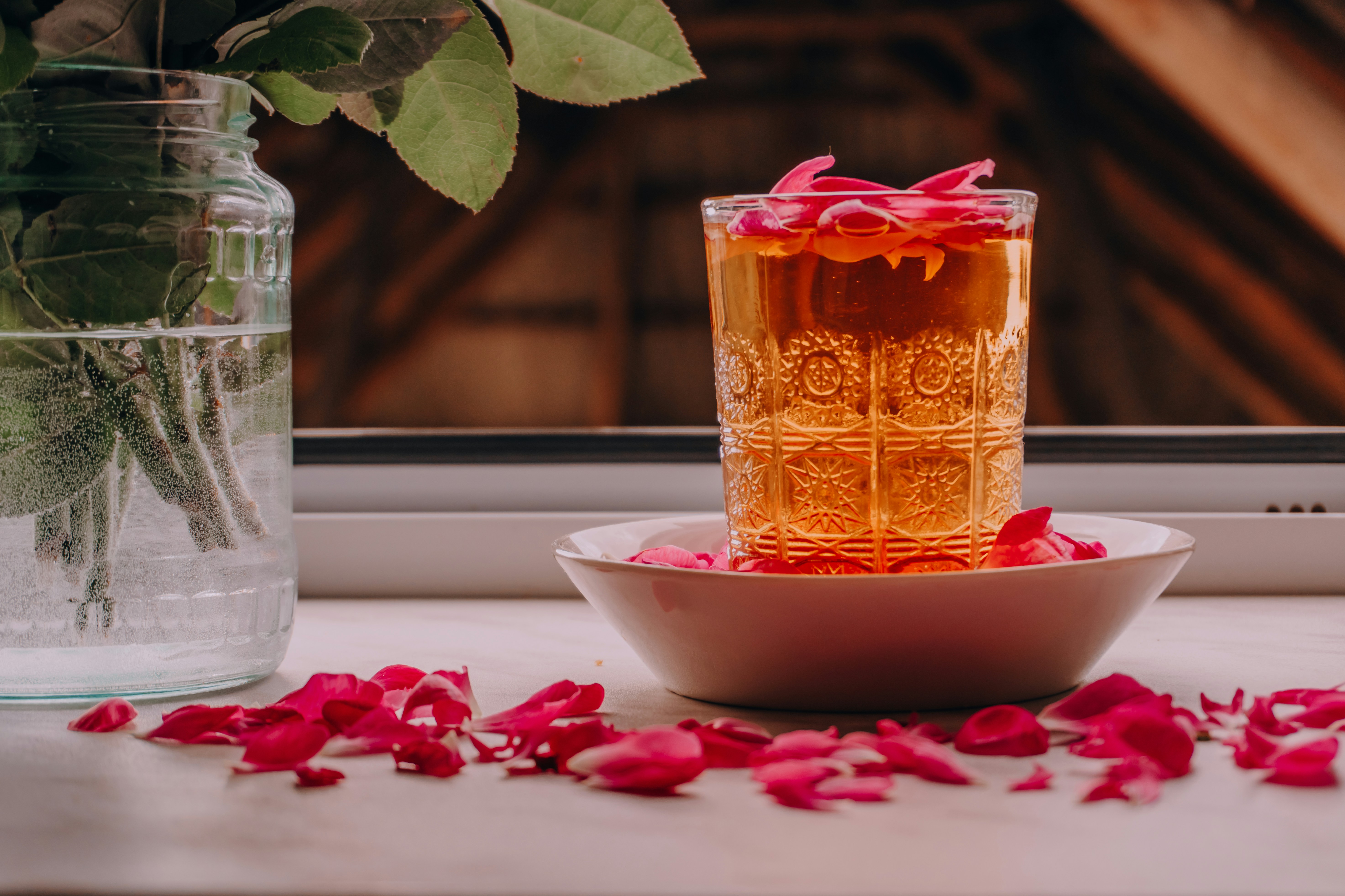 Petal-Top Amber Elixir Framed by a Window Sill