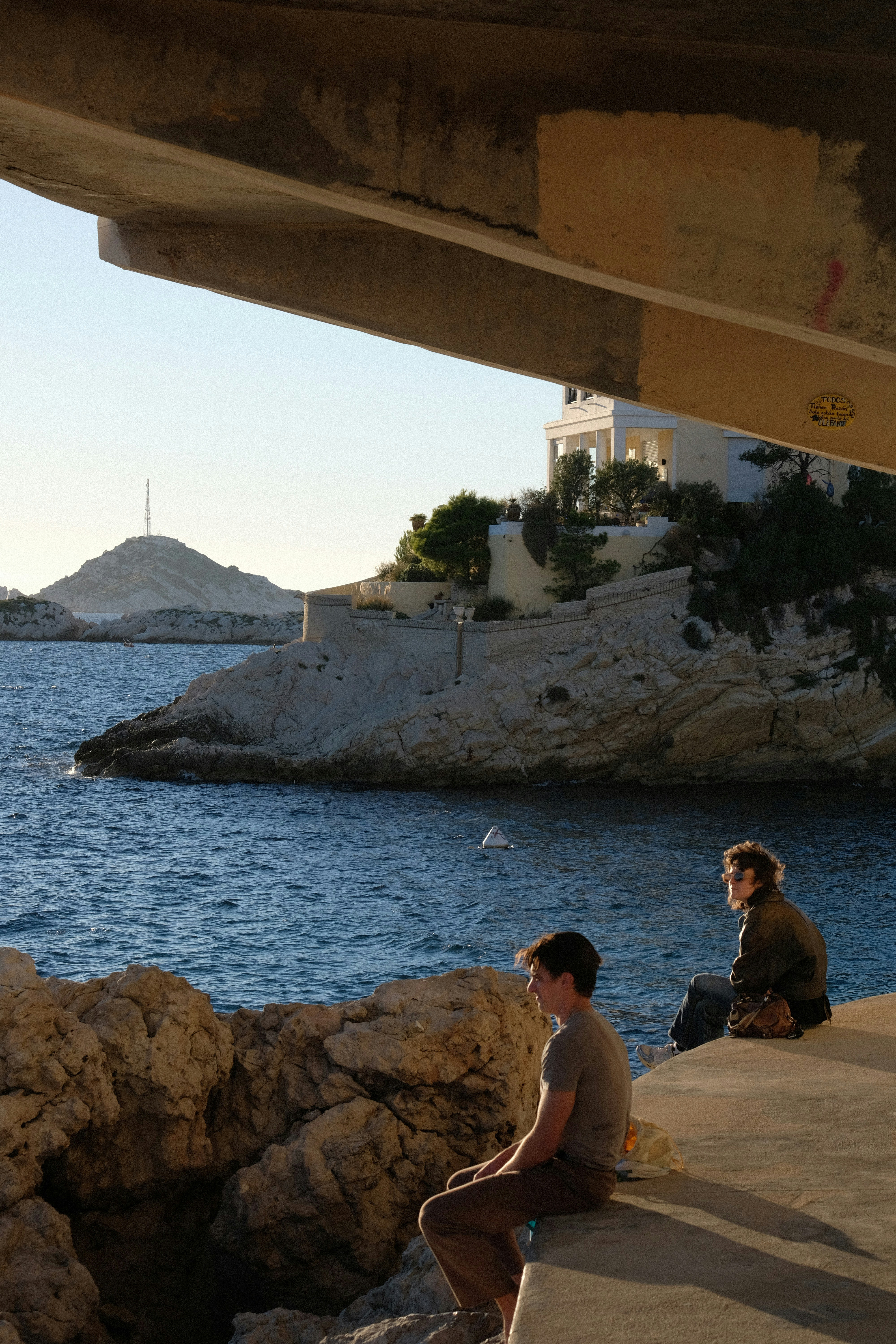 Edge of the Sea: Quiet Moments Beneath a Coastal Bridge