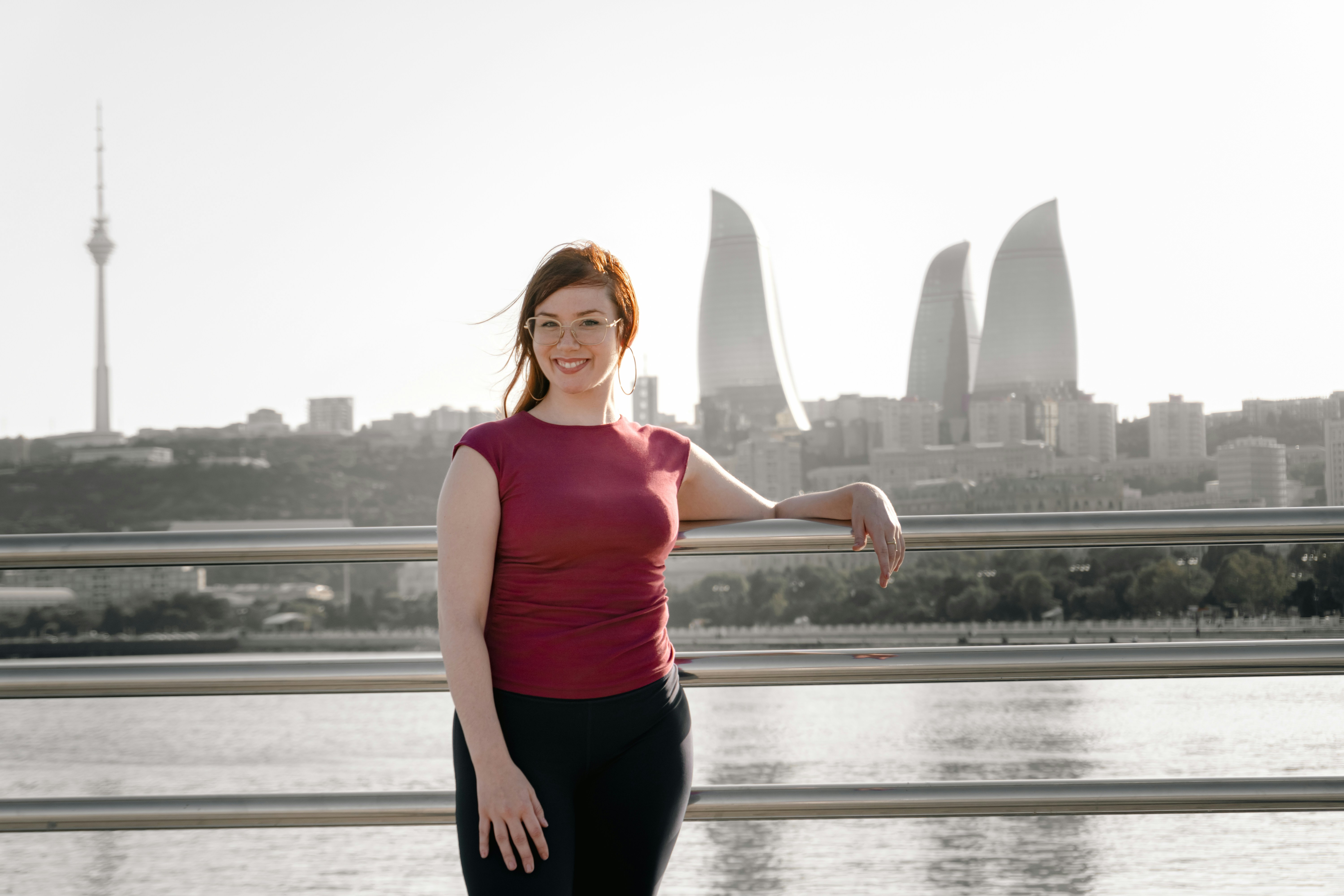 Caspian Waterfront Portrait: Burgundy Top Against Baku's Flame Towers