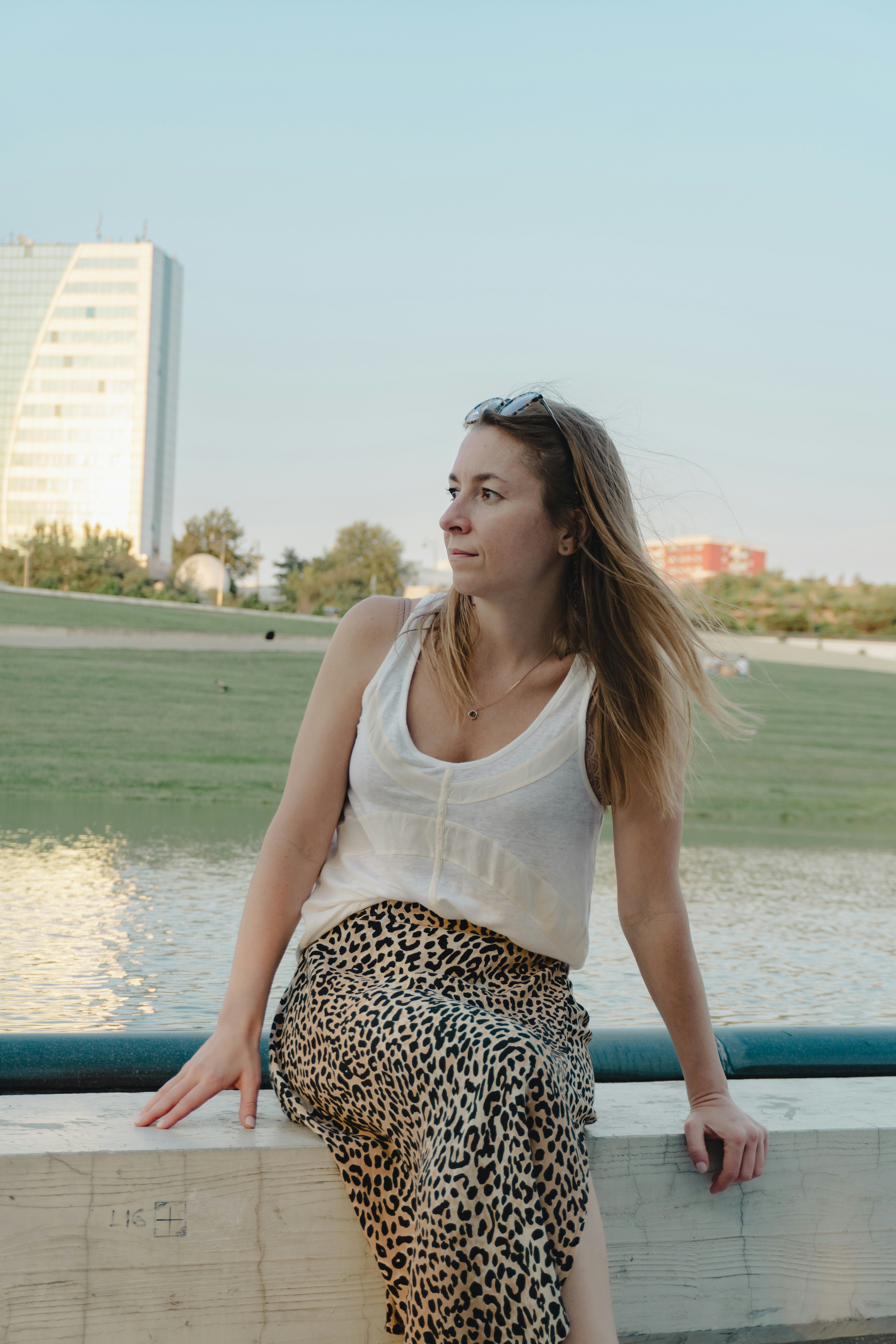 Riverside Quiet: Portrait in Sunlight with Leopard Print