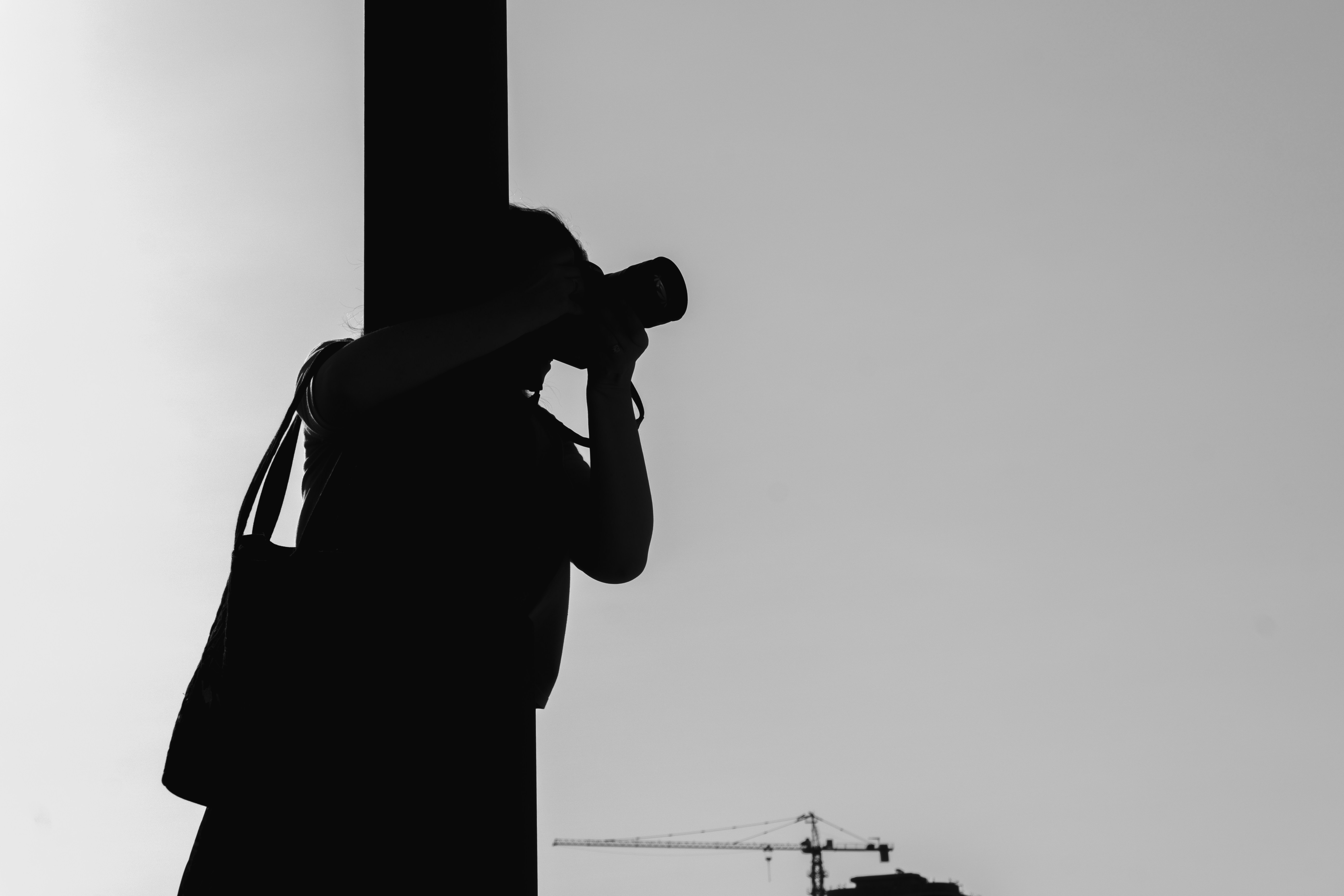 The Silhouette Observer: Urban Hunter with a Telephoto Gaze