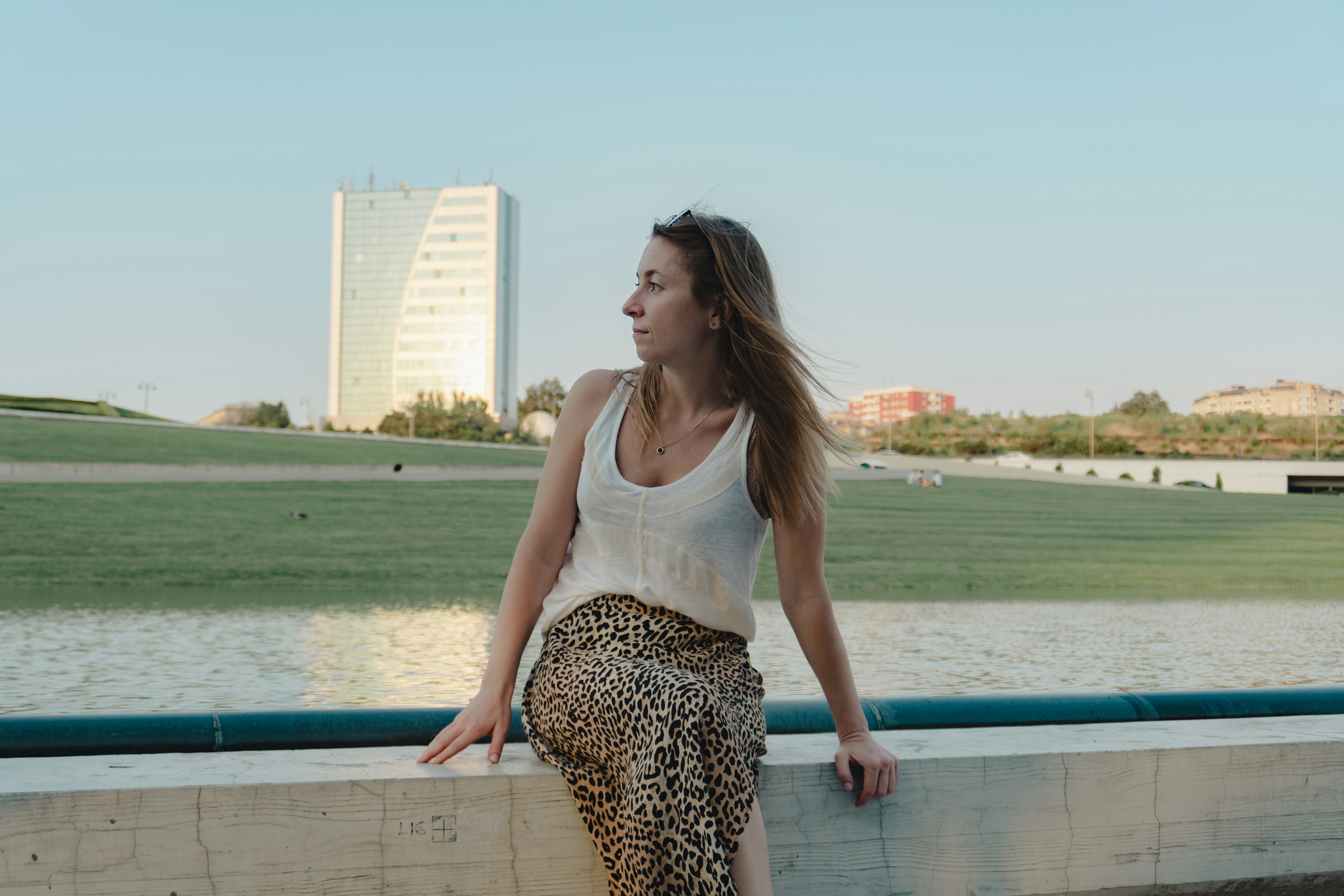 Riverside Portrait in Leopard Print: Quiet Confidence by the Water