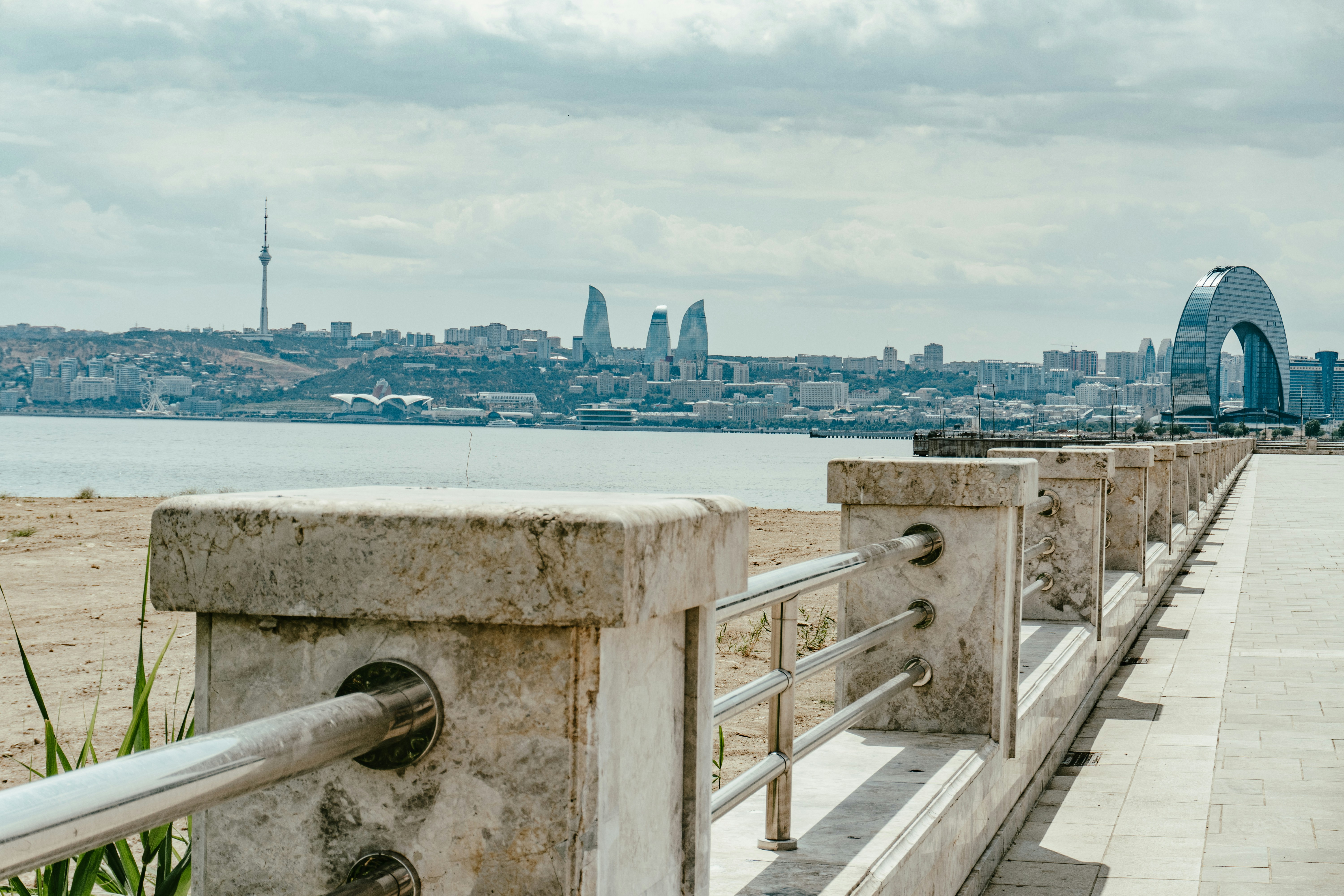 Promenade Lines Converge on a Glass-City Horizon