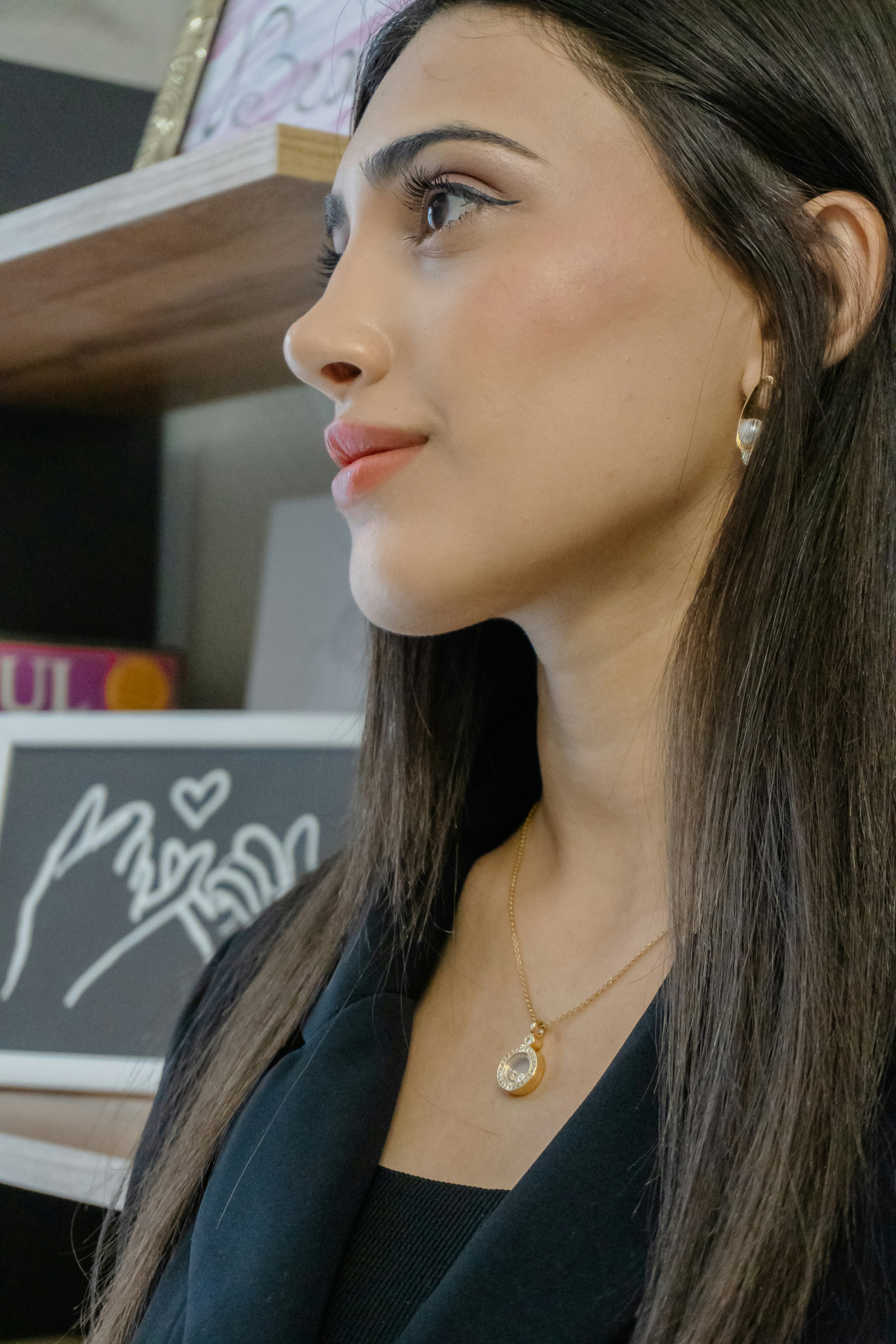 Profile in Soft Studio Light: A Quiet Portrait with a Golden Pendant