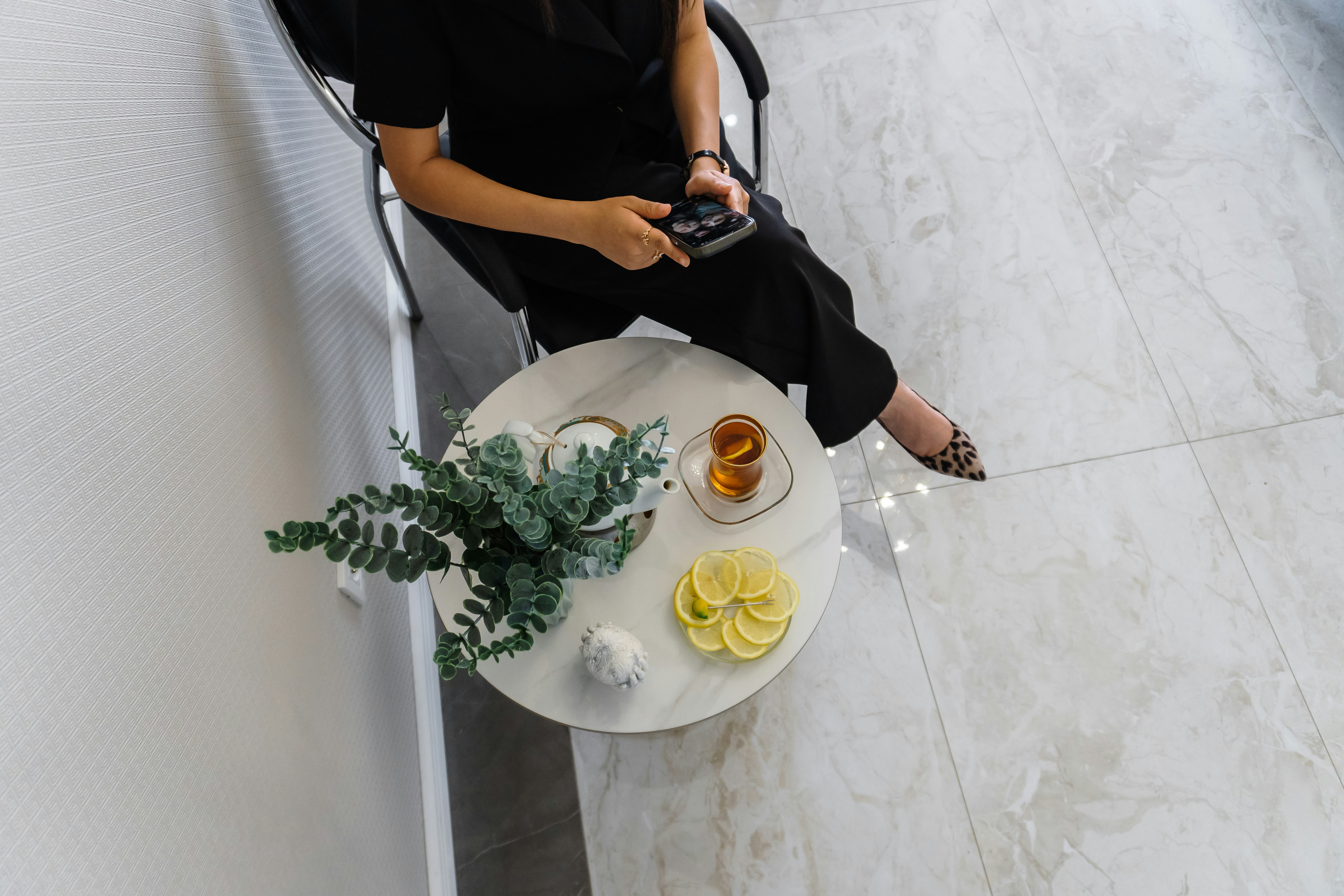 A Quiet Moment: Espresso and Lemon Slices on a Marble Table