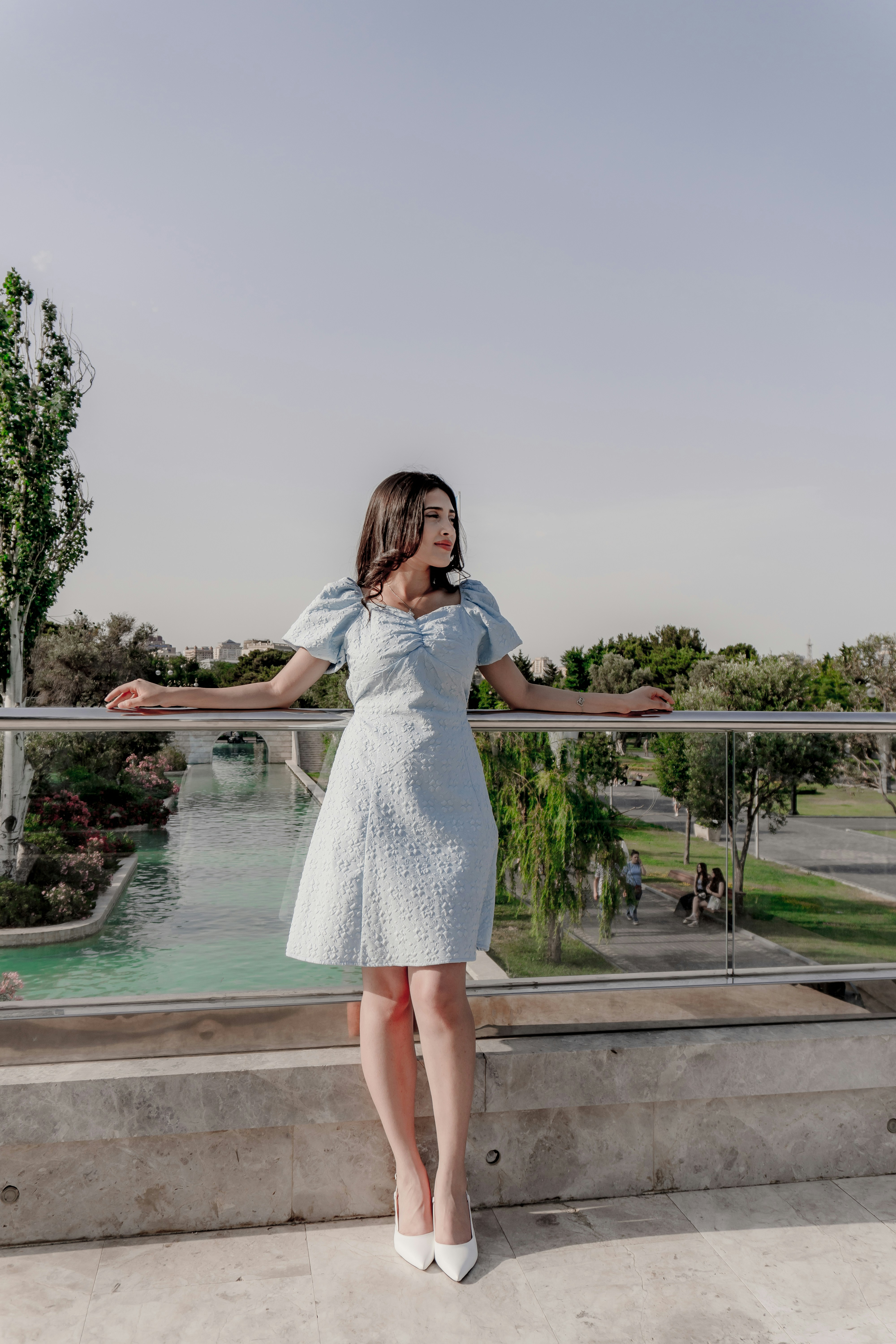 Porcelain in Sunlight: Balcony Portrait by the River