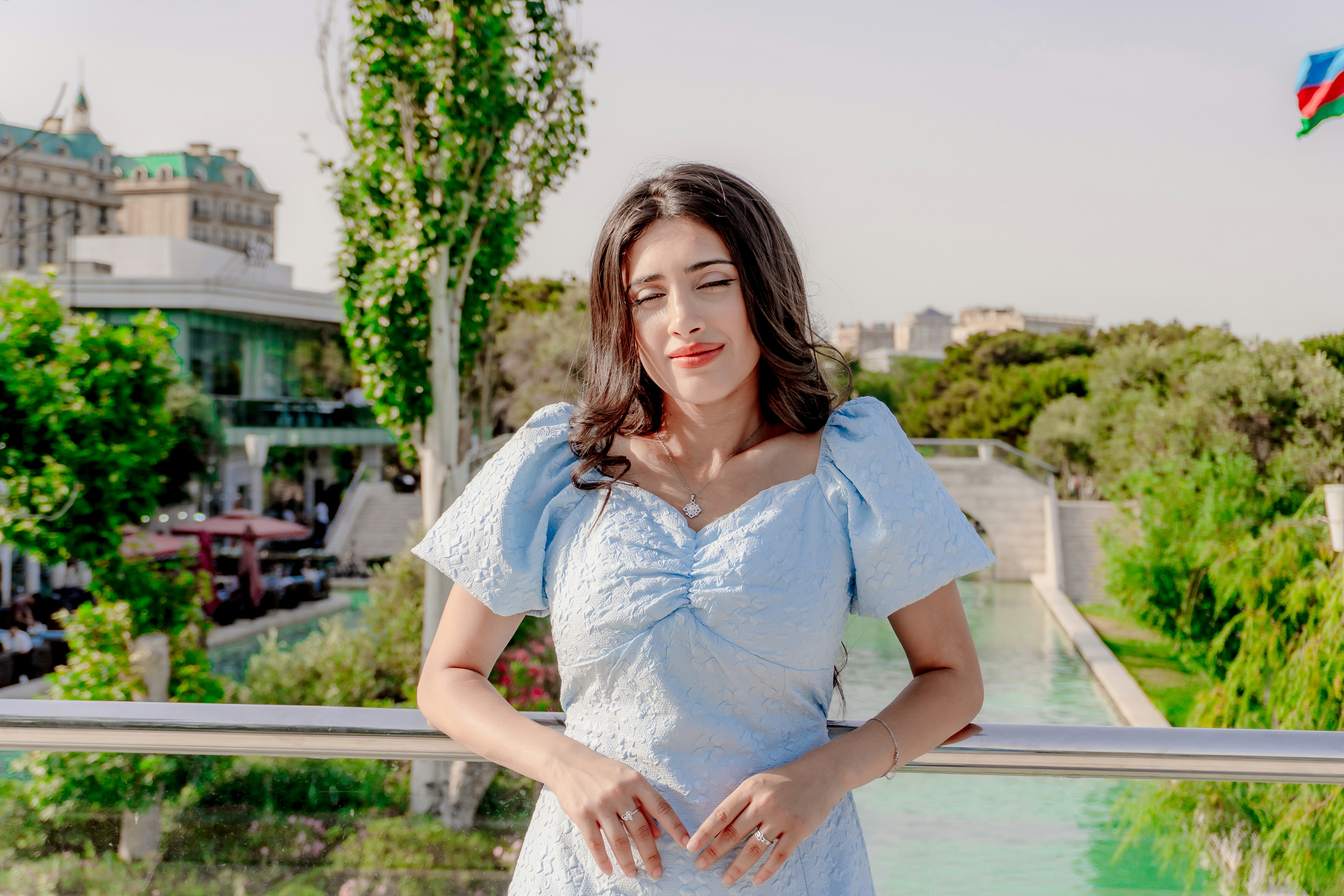 Azure Quiet: Portrait on a Green Riverside Terrace