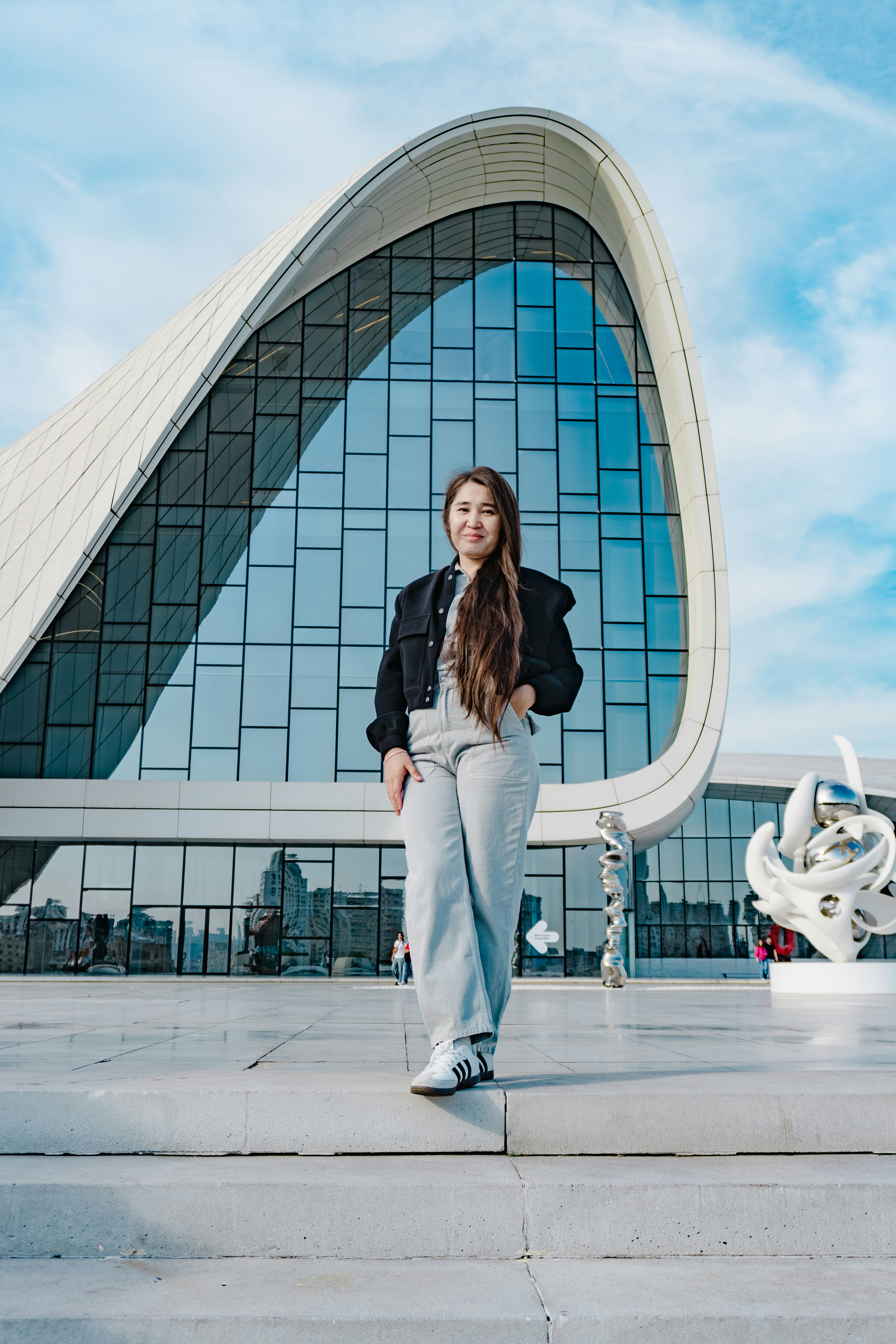Arc of Glass, Center Stage: Portrait Before the Curved Facade