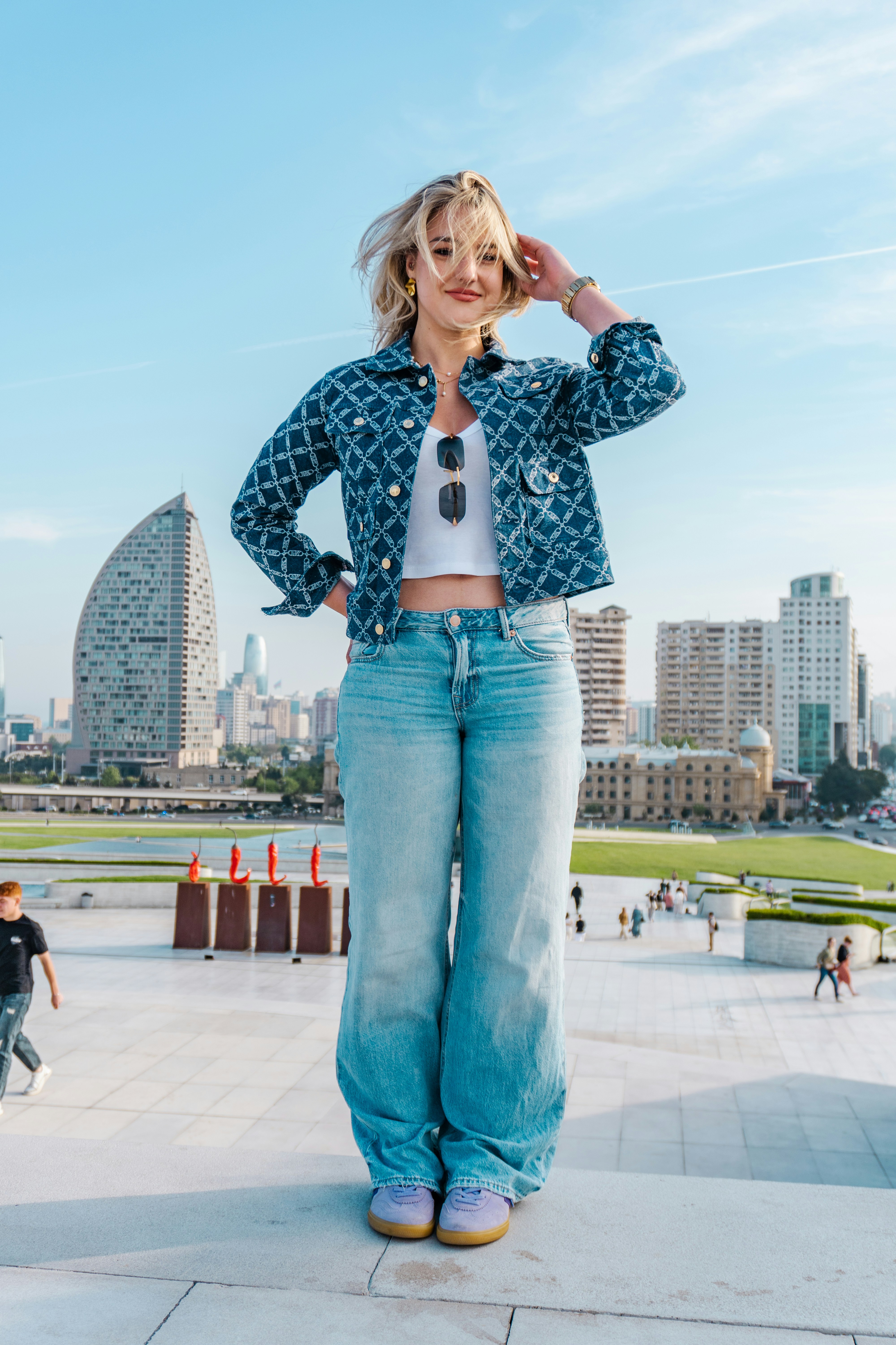 Cityscape Portrait: Denim Jacket, Wide-Leg Jeans and a Sunny Smile