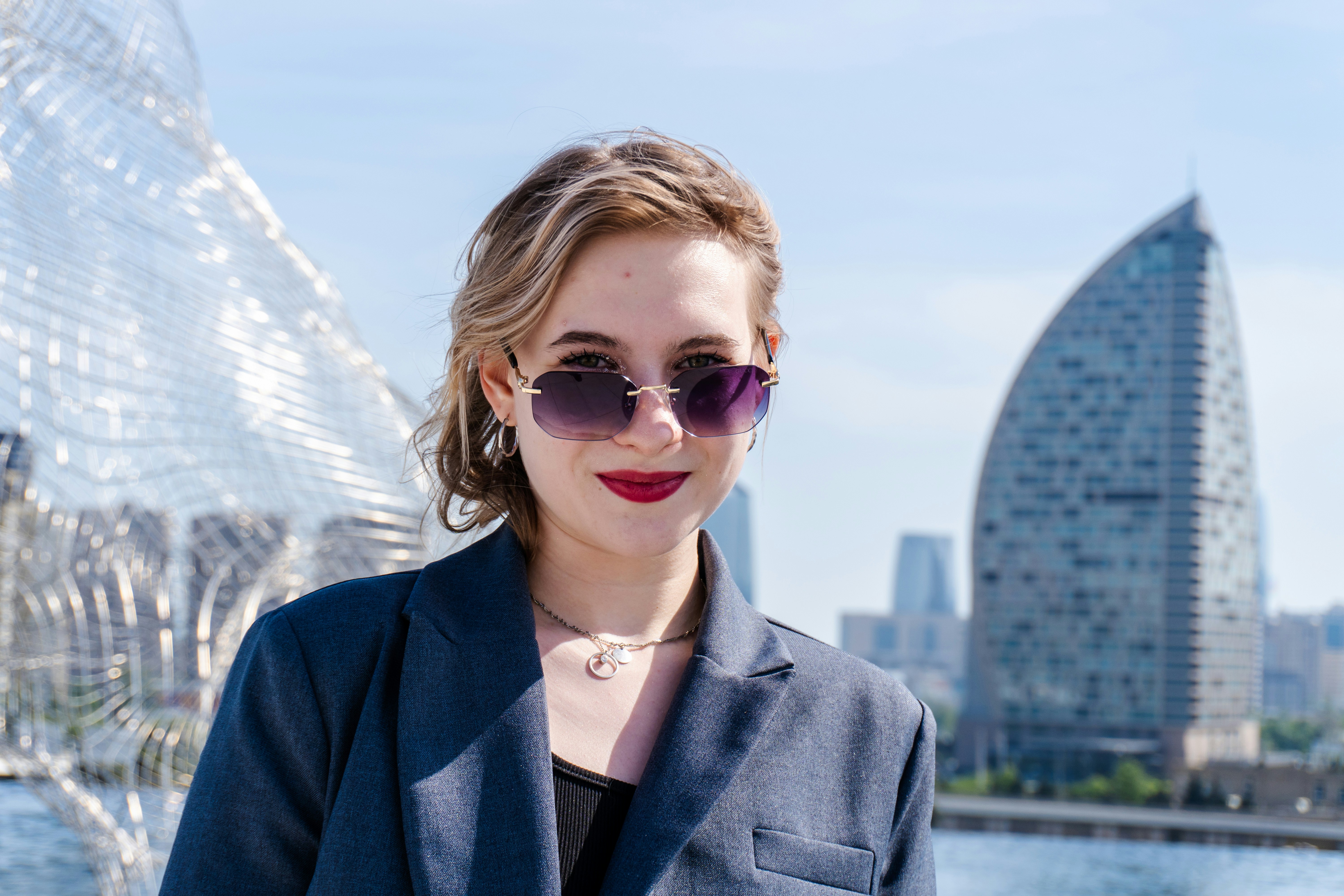 Harbor Portrait: Urban Confidence Under Futuristic Glass Arches