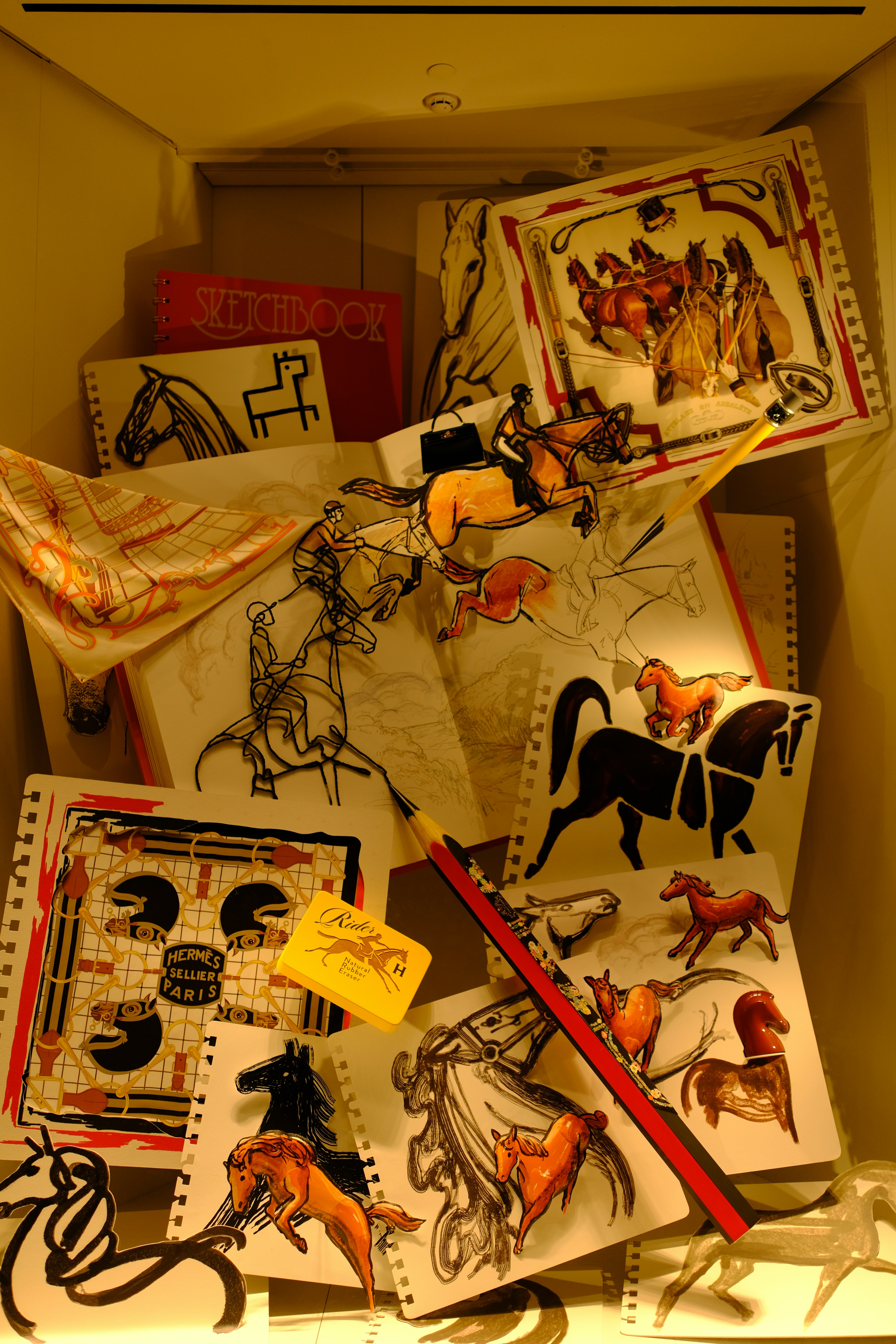 Collection of horse sketches and art supplies