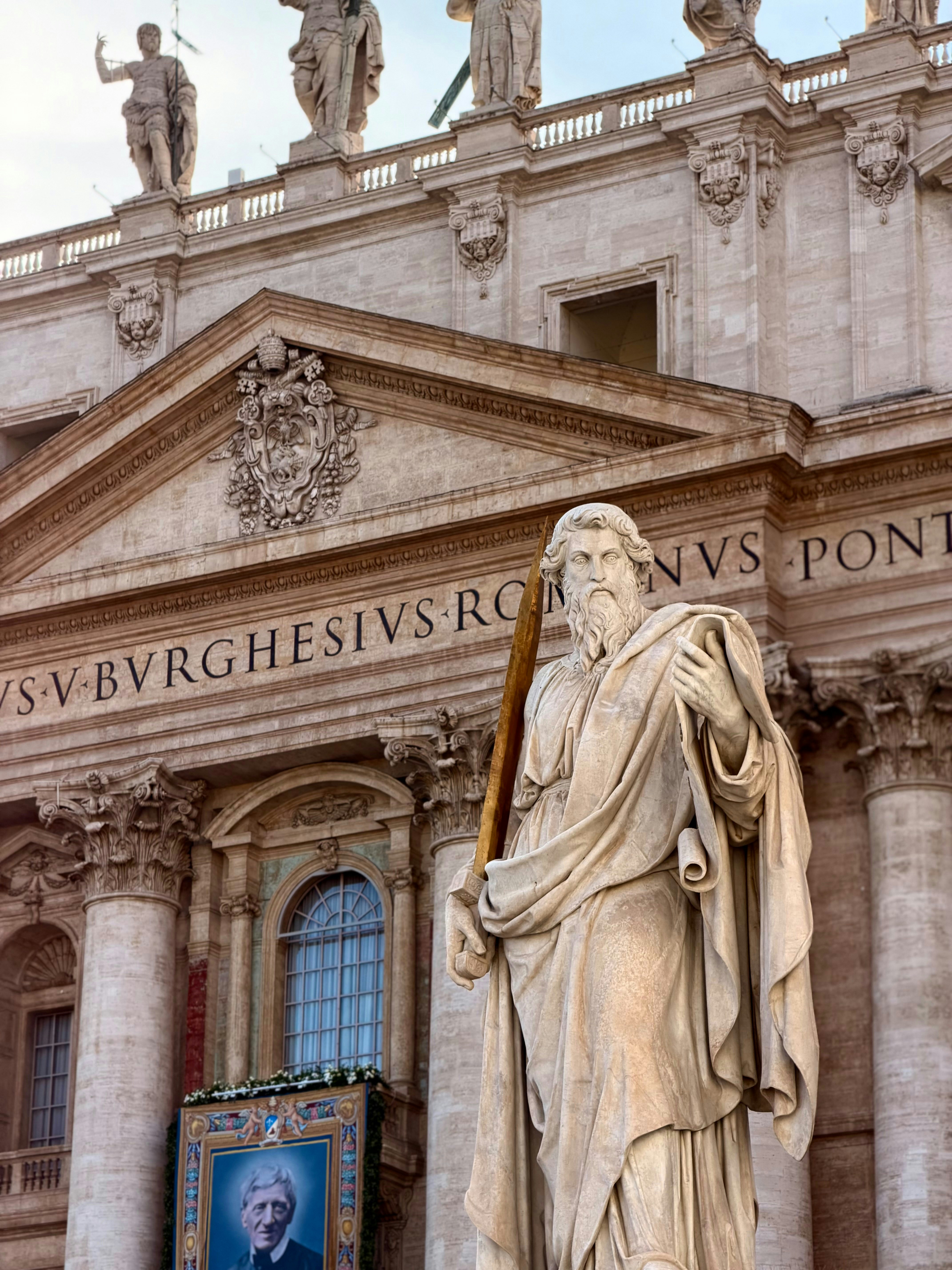 Bearded Guardian of Rome: Marble Statue Before the Imperial Facade