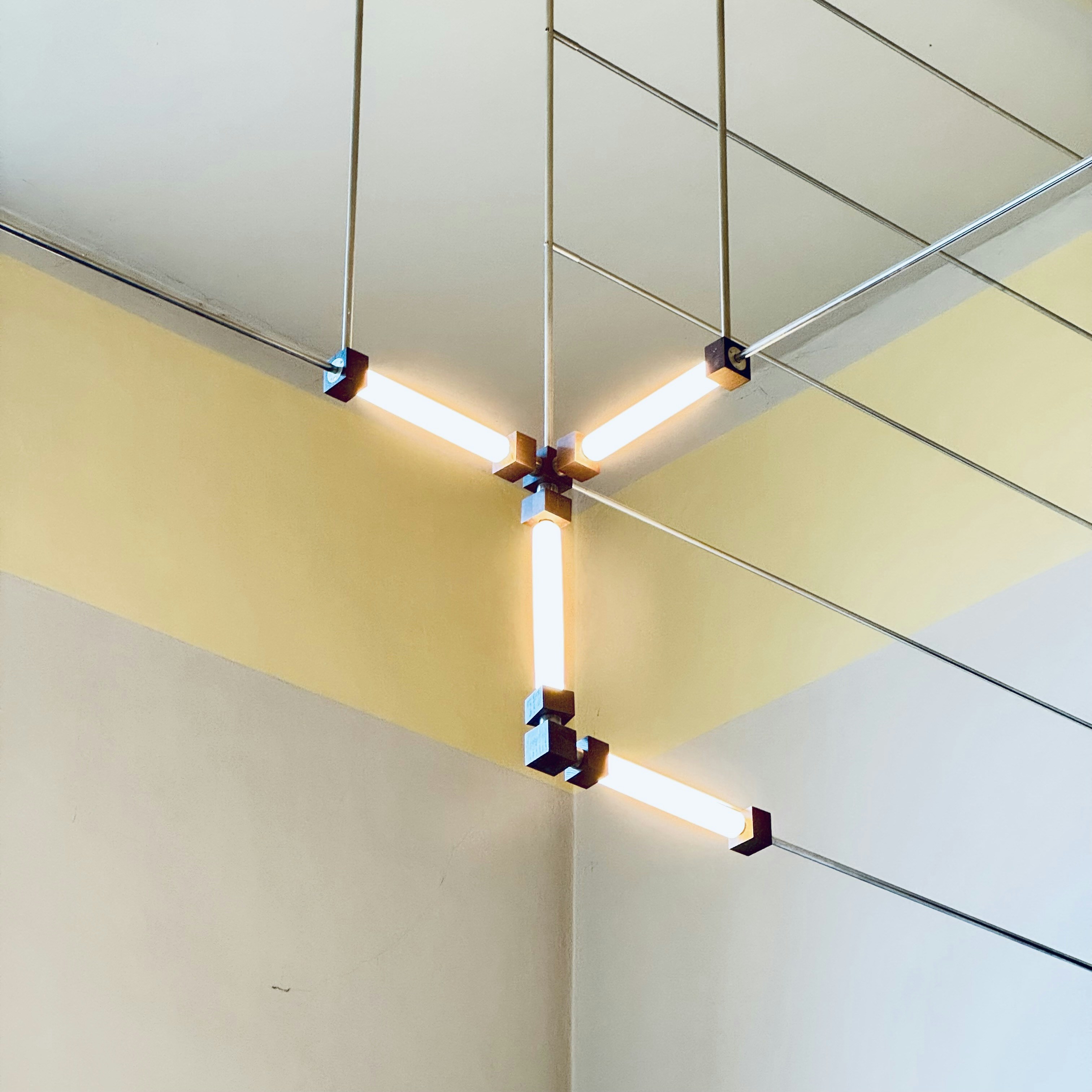 Neon Junction: Geometry of Light on a Minimal Ceiling