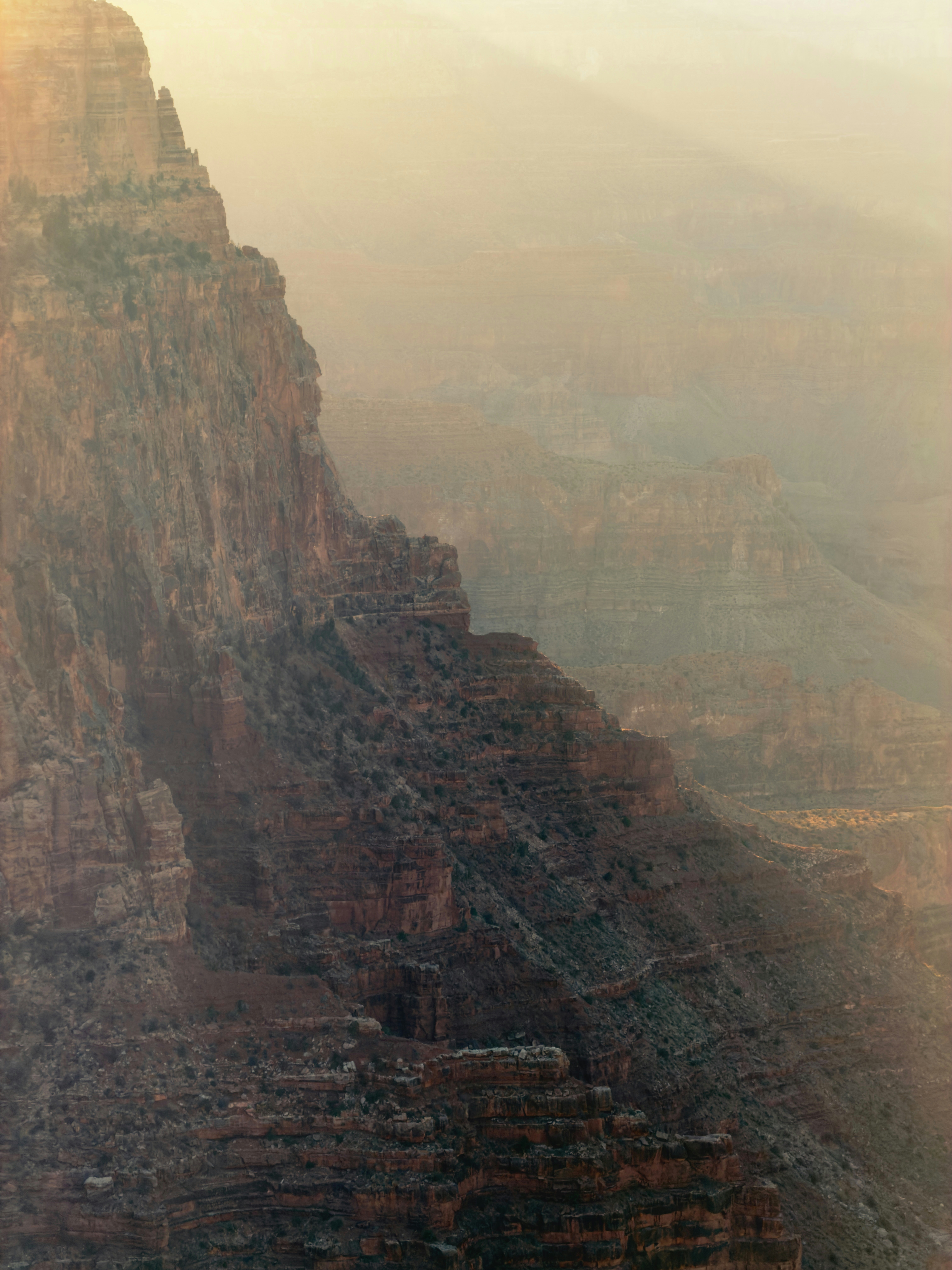 Sunlit Canyon Rim Hidden in Morning Haze