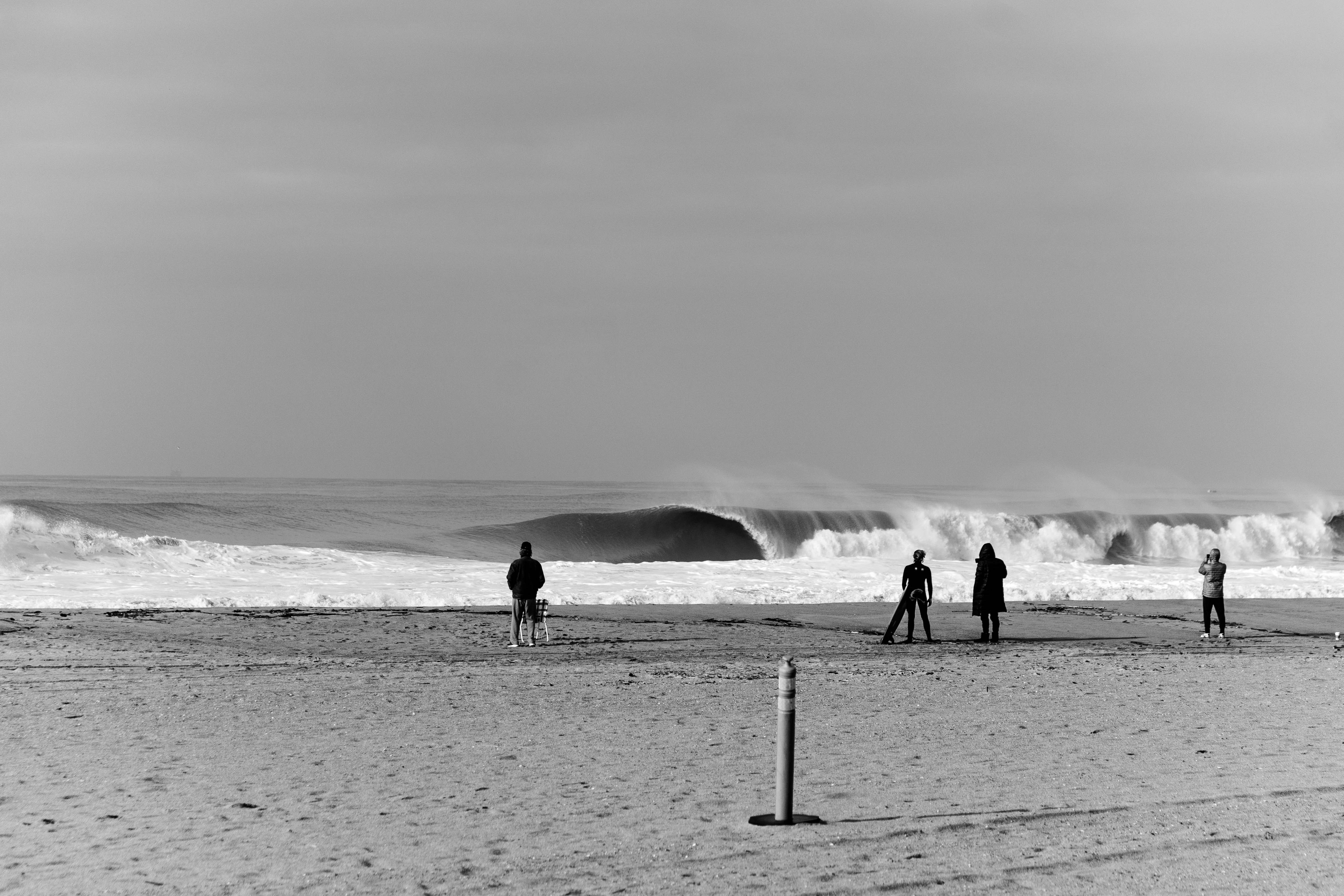 Shoreline Witnesses: Tripods and Tide in a Monochrome Moment