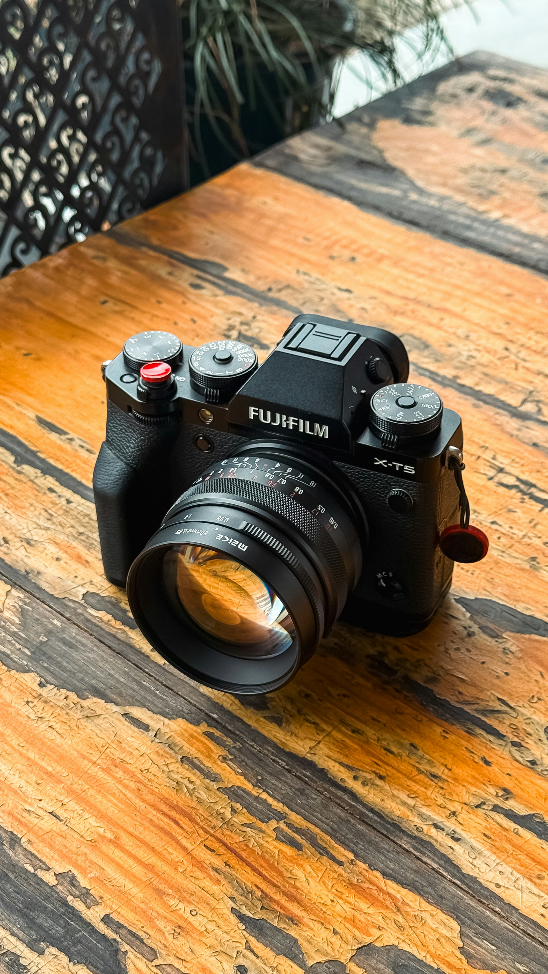 Black fujifilm camera with lens on wooden table photo – Free Technology ...