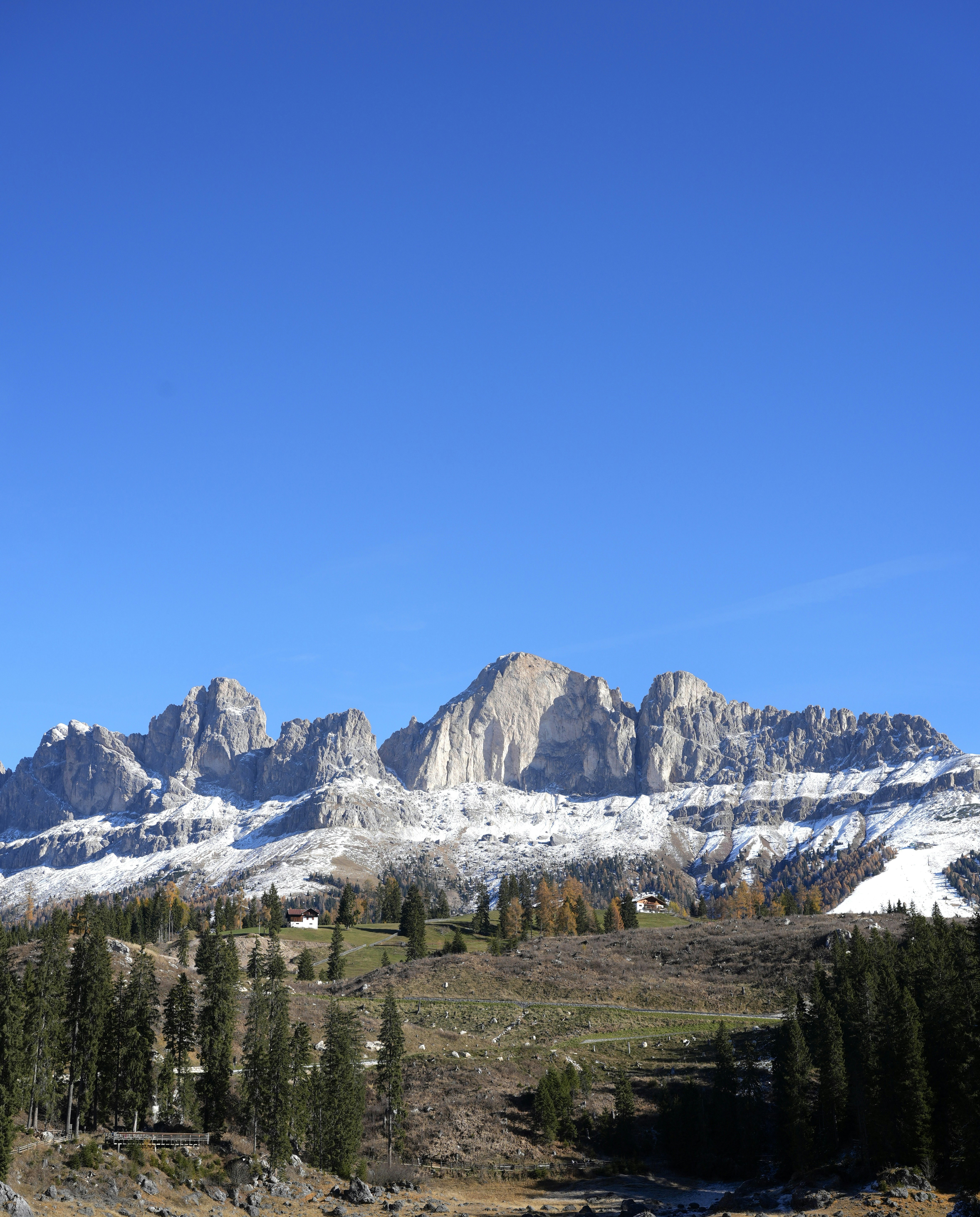 Cerulean Sky Over a Snow-dusted Alpine Ridge