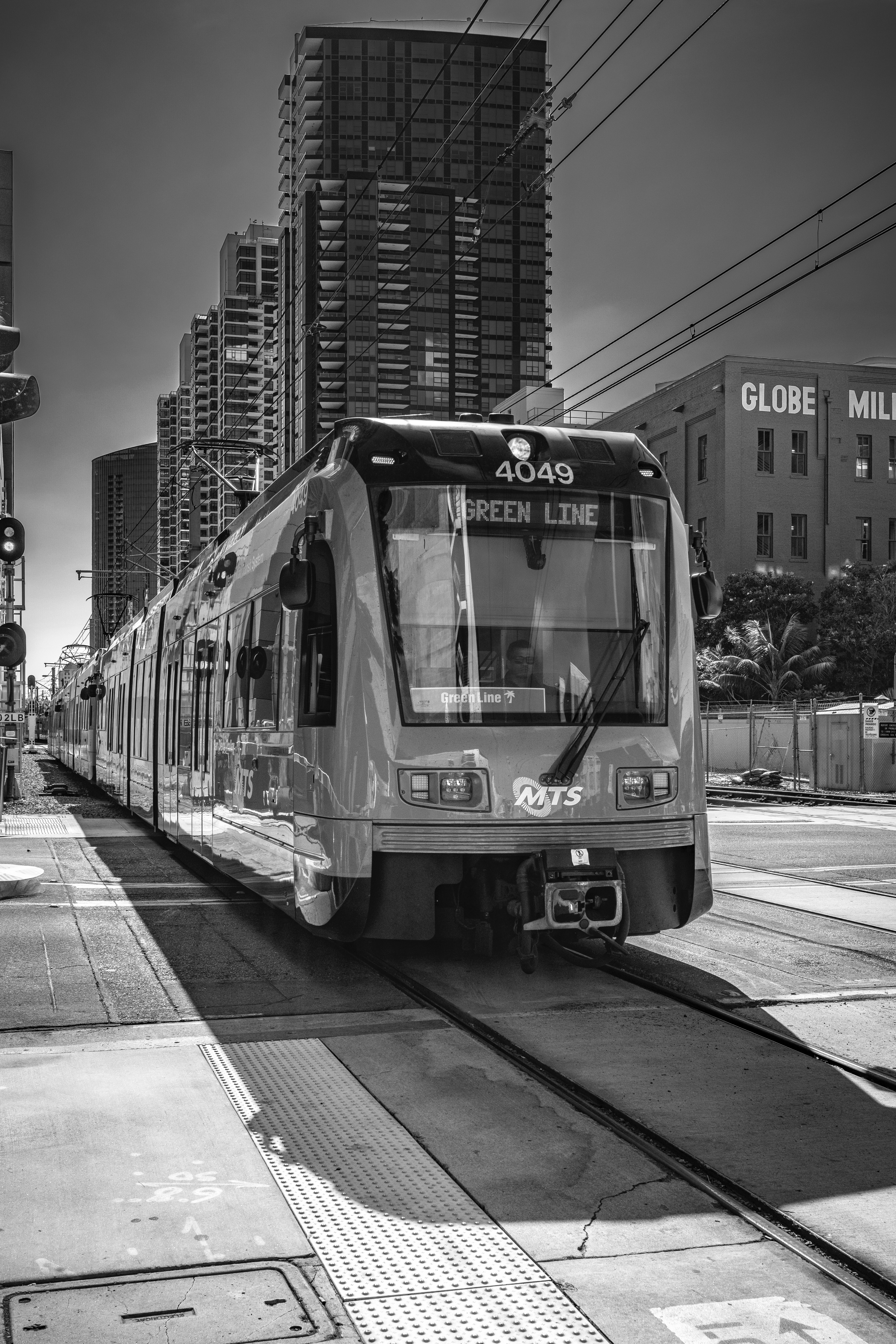 Urban Rail, Steel Beam Horizon: A Front-View Streetcar Leads the Way
