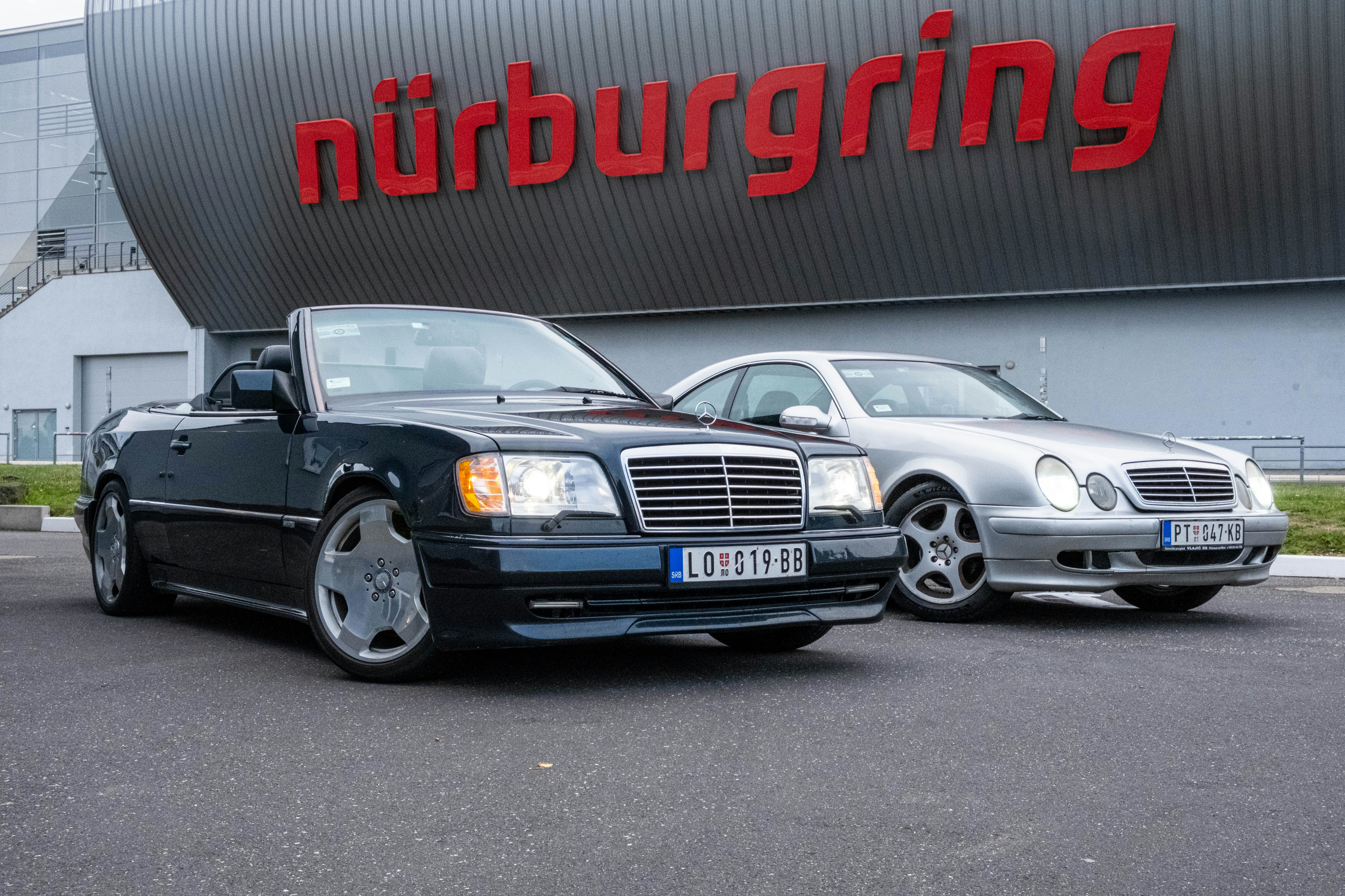 Dual Mercedes Classics Resting Beneath the Nürburgring Sign