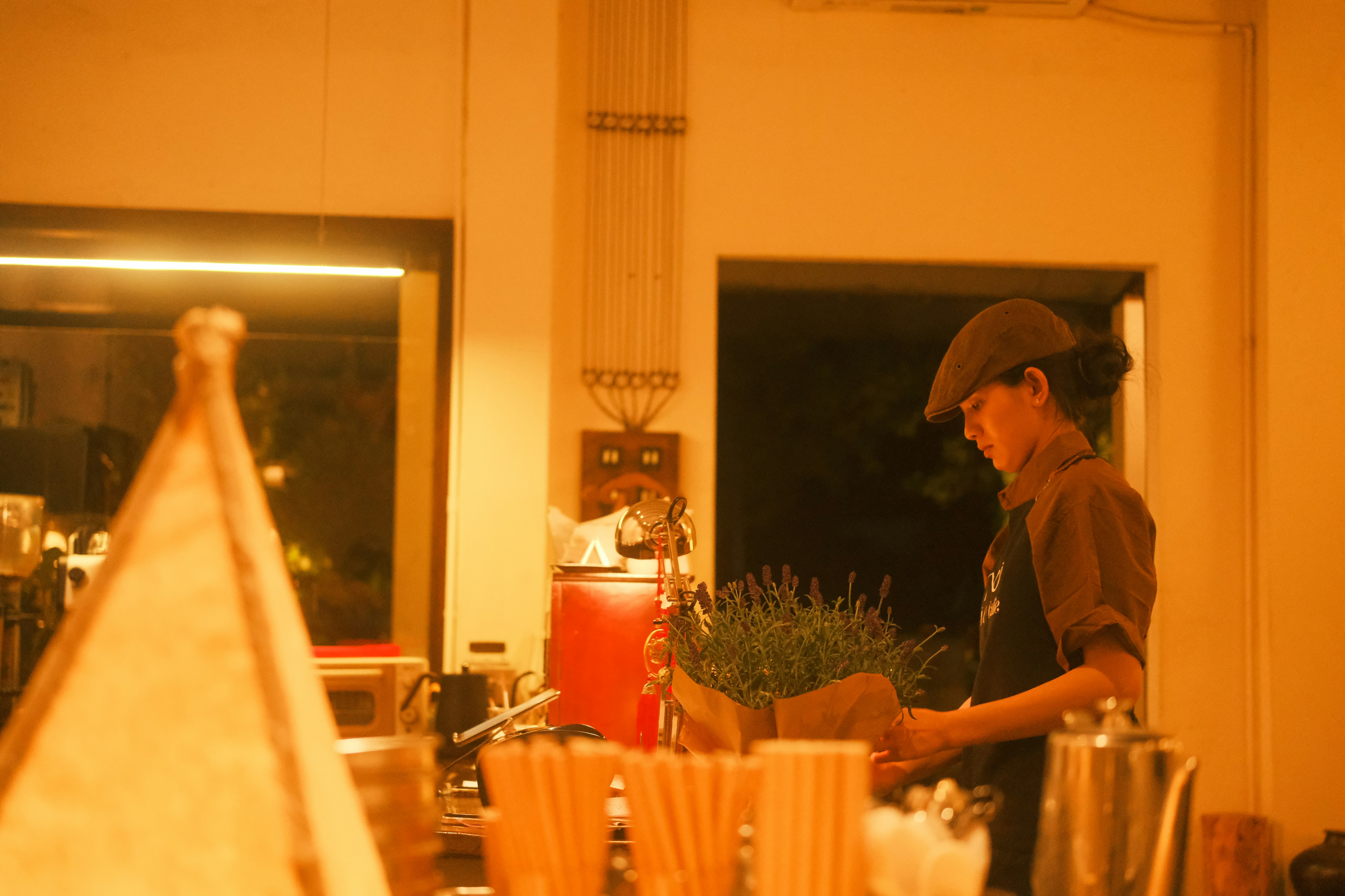 Amber-Whispered Craft: A Barista at a Quiet Counter