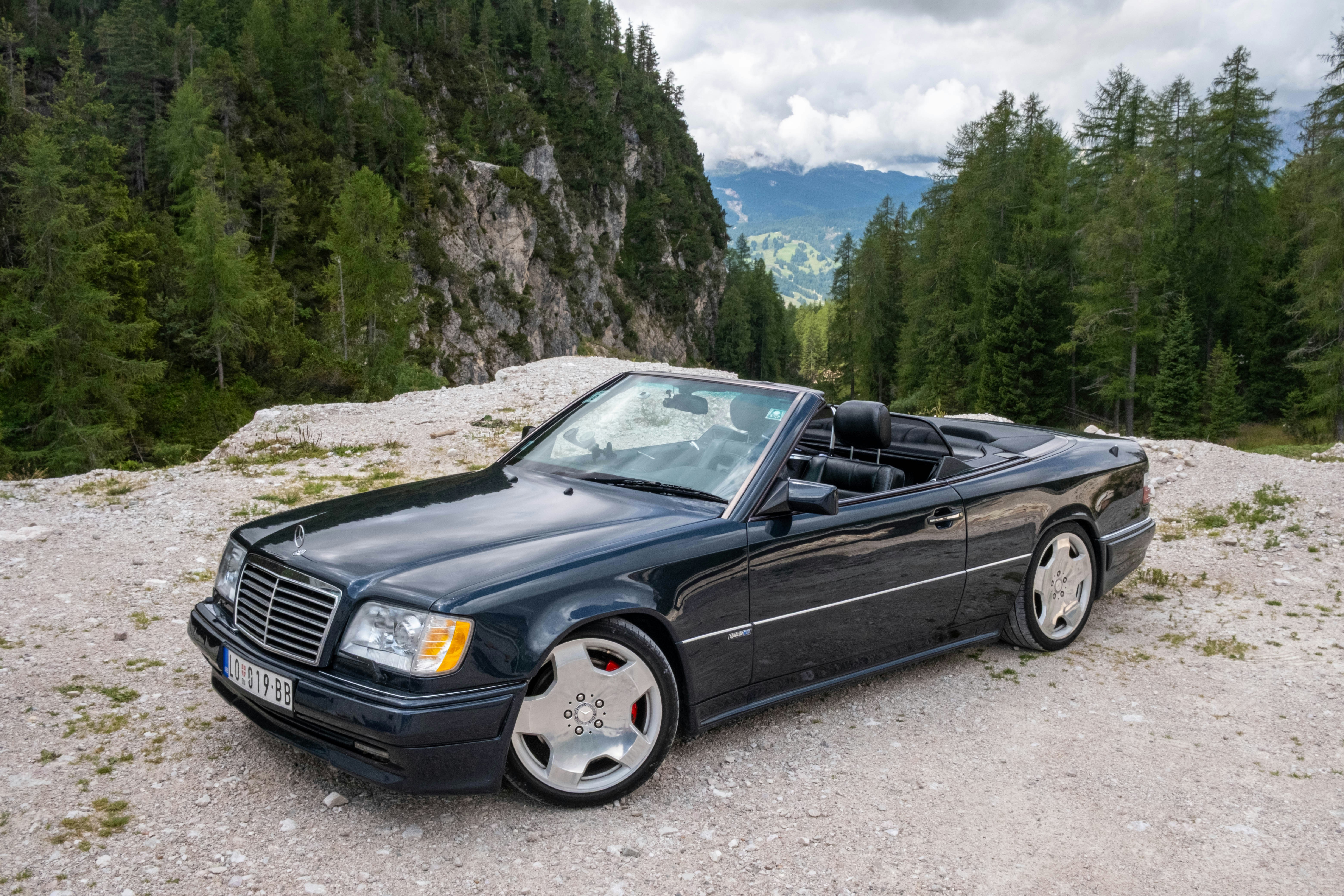Granite Overlook Cabriolet: A Noir Convertible Framed by Alpine Pines