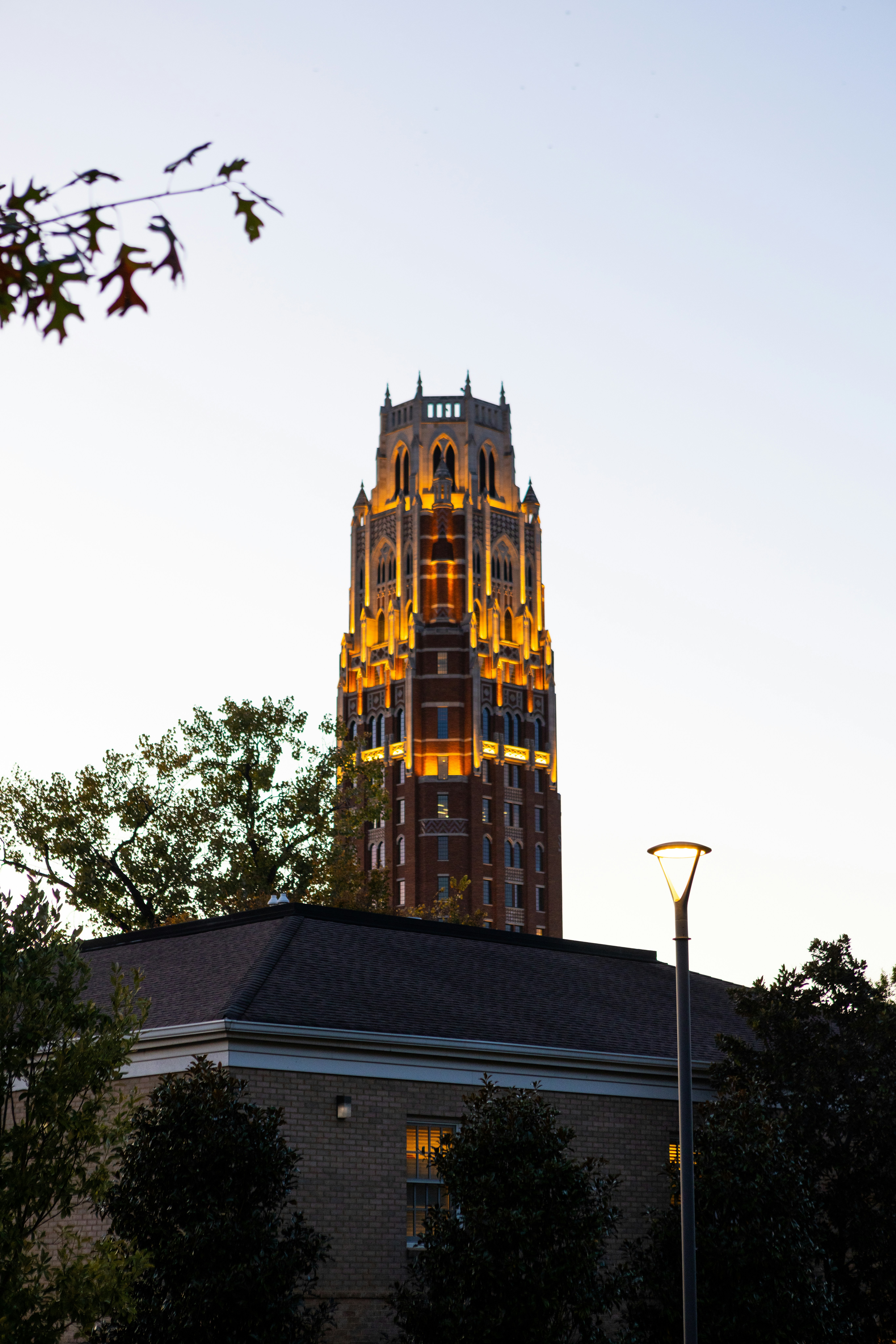 Amber Crown at Dusk: A Gothic Tower Rising over Quiet Campus