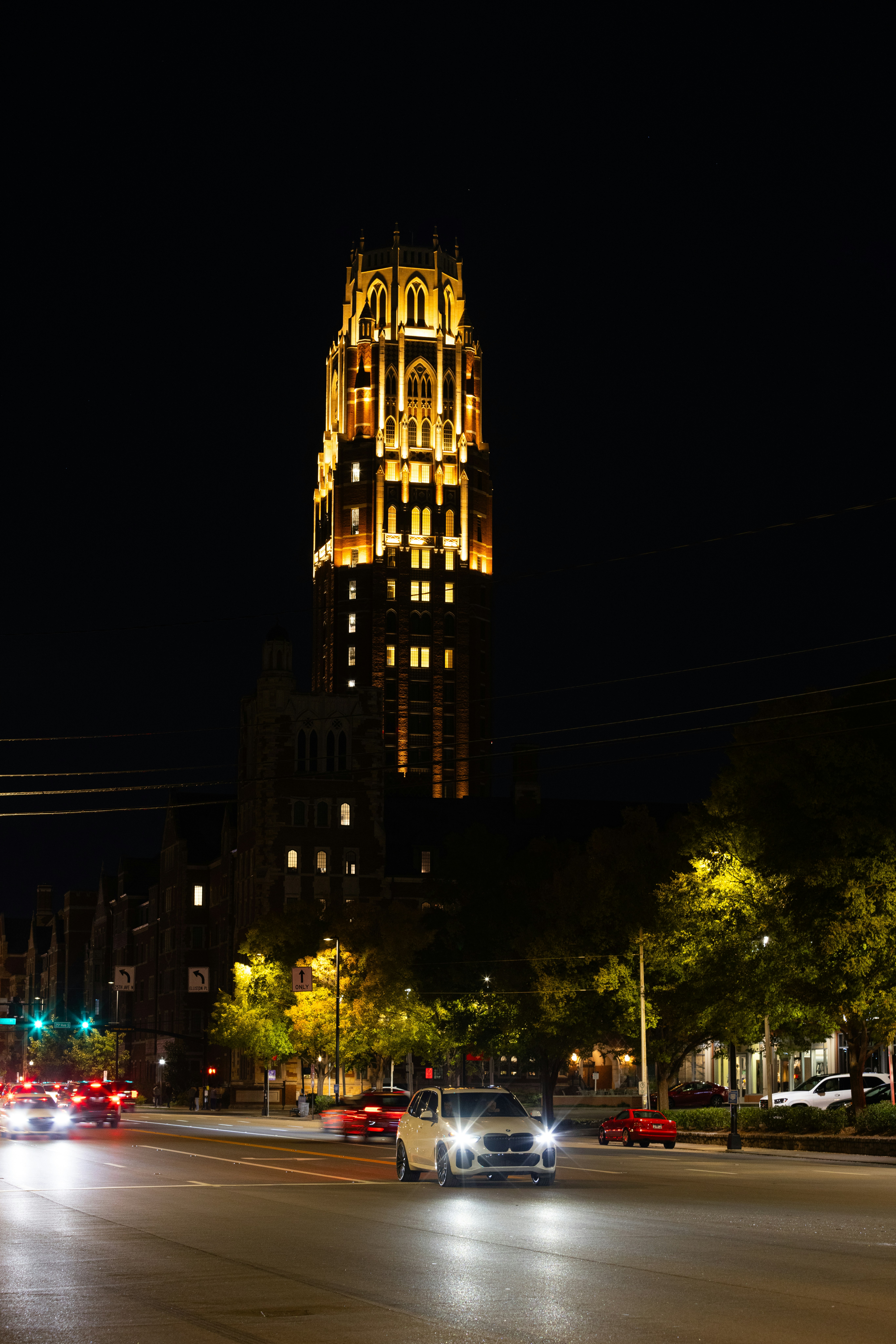 Beacon in the Dark: A Gothic tower lights up a city street