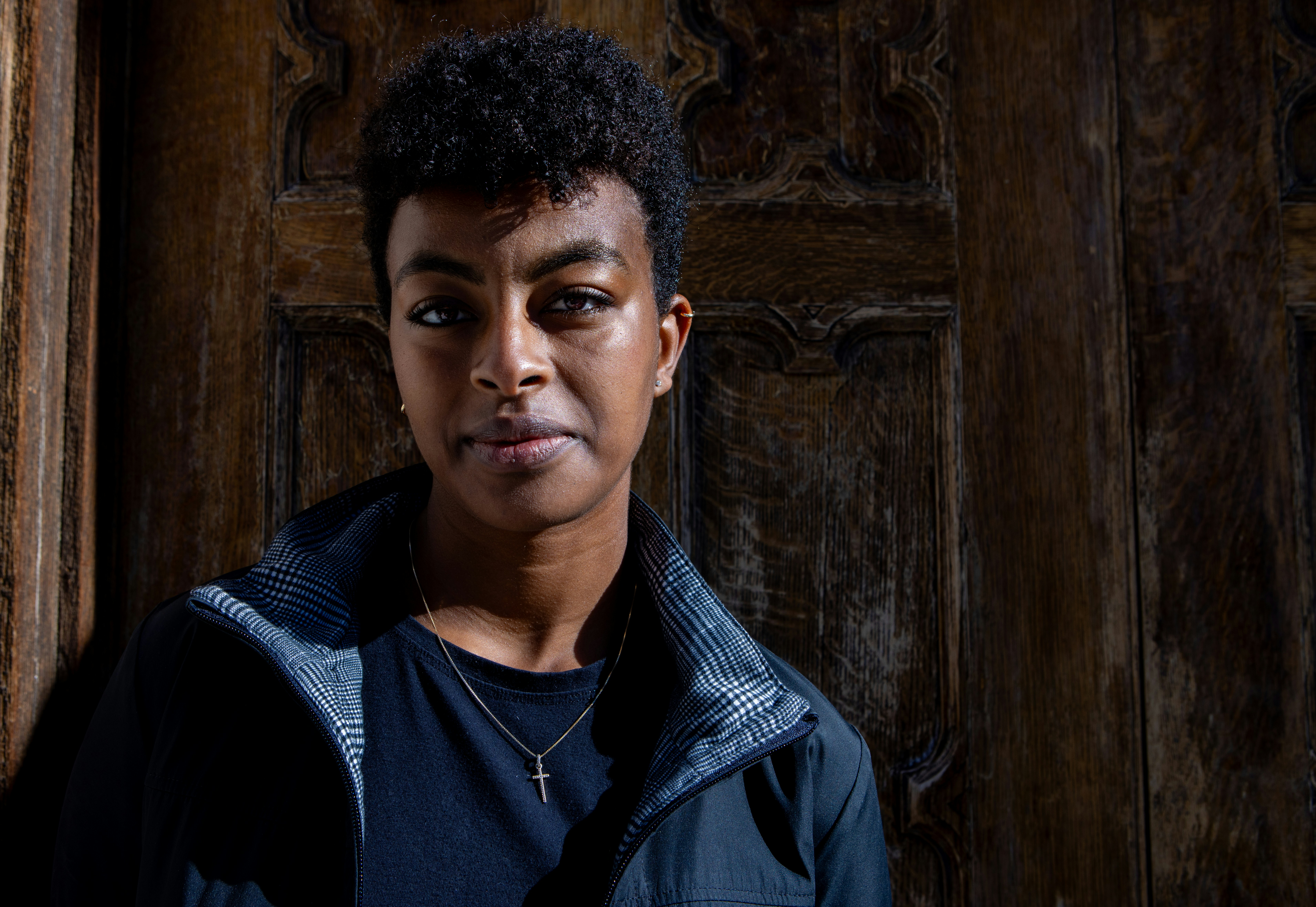 Model Naomi looks directly into the camera during a photoshoot in the Mountain View Cemetery's chapel in November, 2025, Pocatello, Idaho.