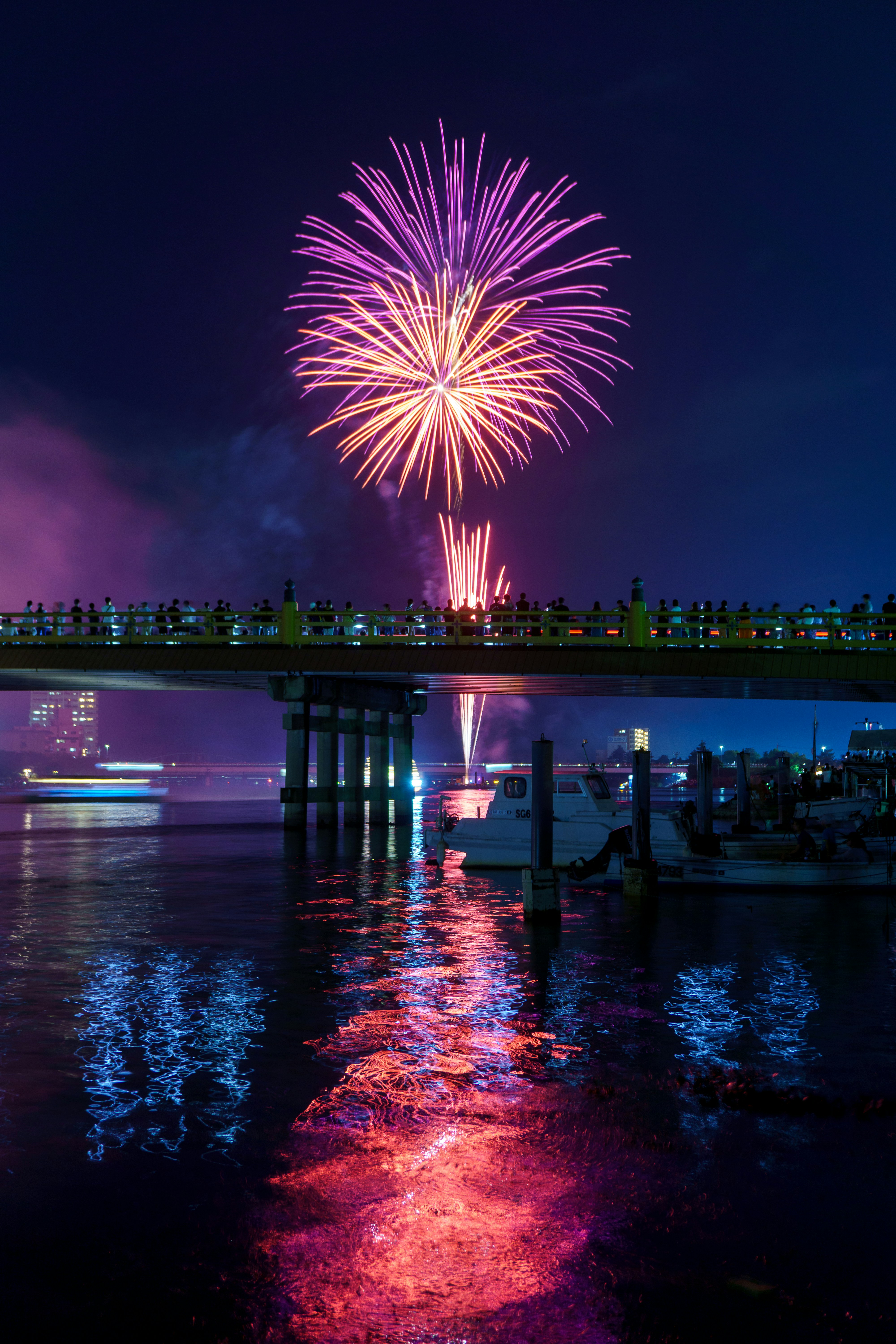 Neon Bloom Over the Marina Bridge: Fireworks Reflections