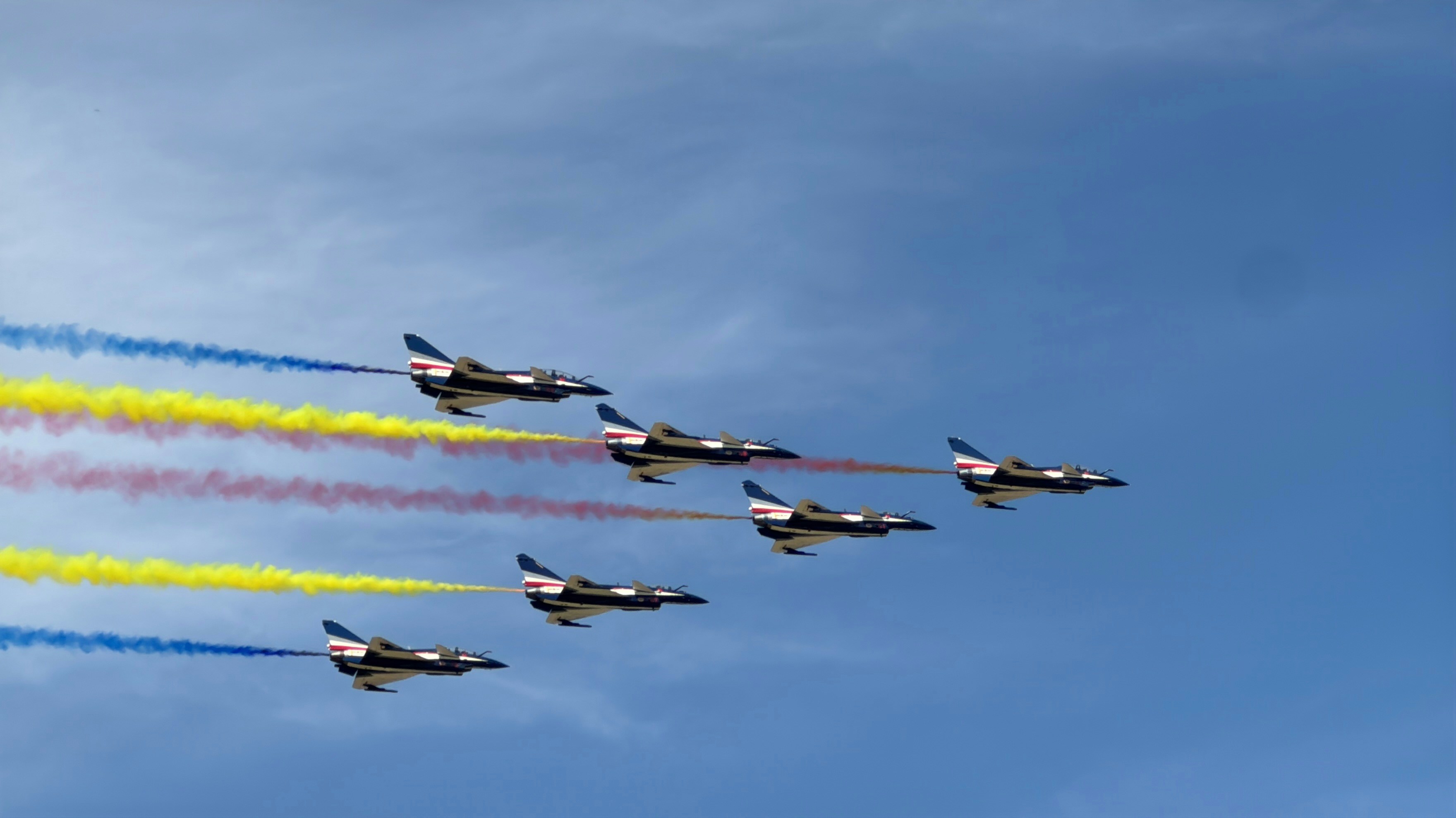 Six-Jet Formation Cuts Through a Blue Sky with Bold Smoke Trails