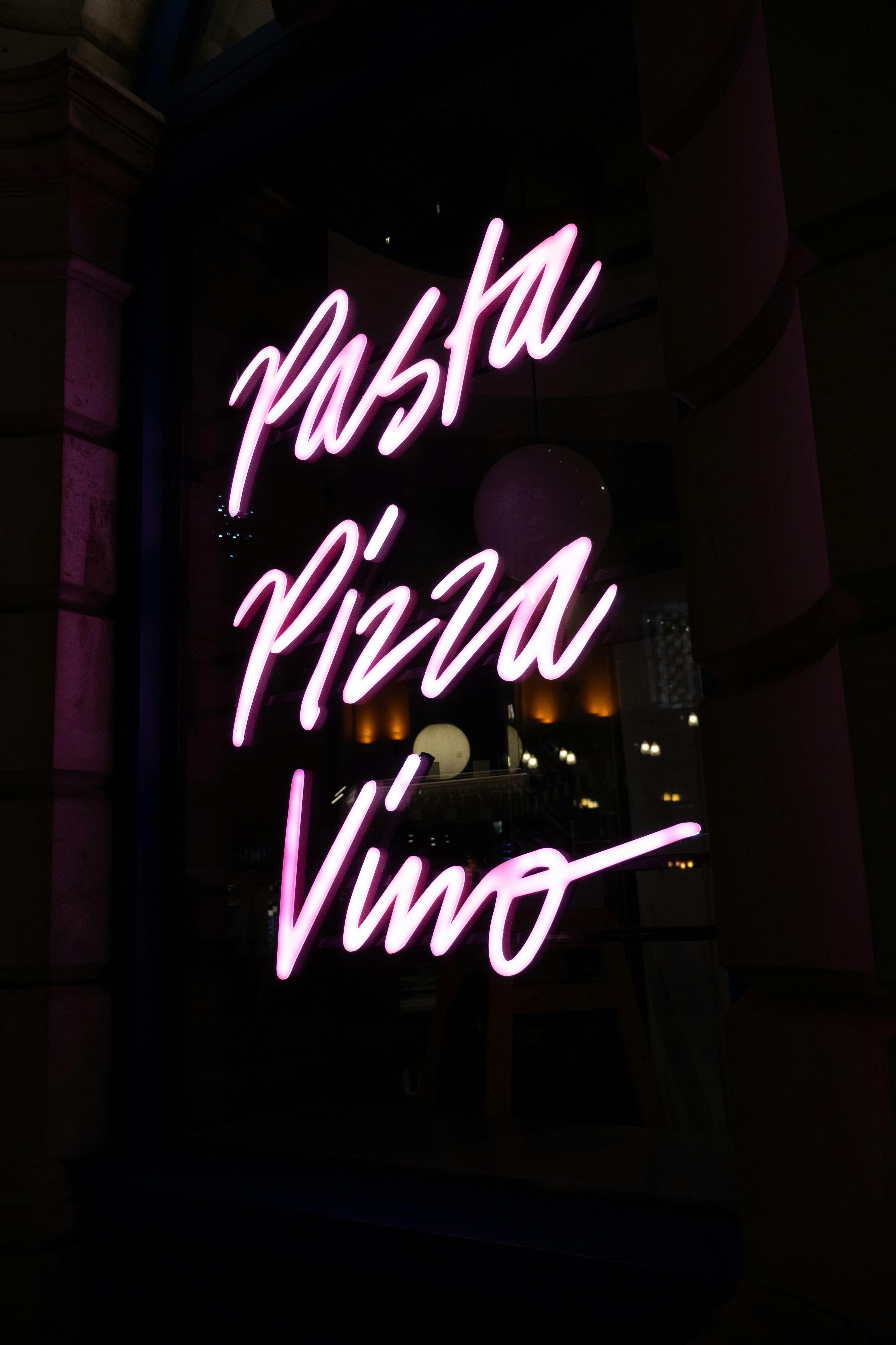 Neon Scripted Menu: Pizza, Pizza, Vino in a Midnight Window