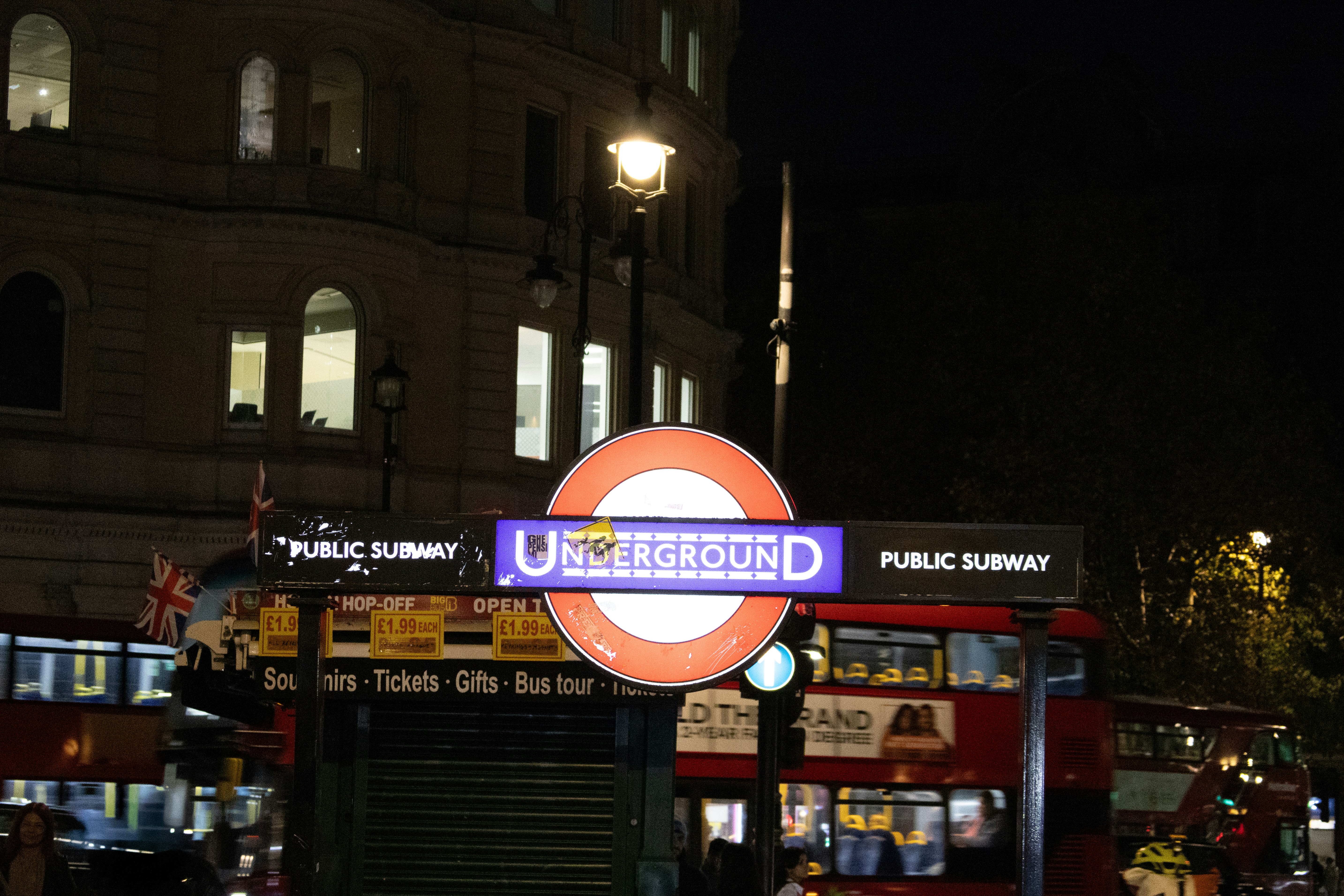 Night Pulse at the Roundel: London’s Brick, Neon, and Waiting Bus
