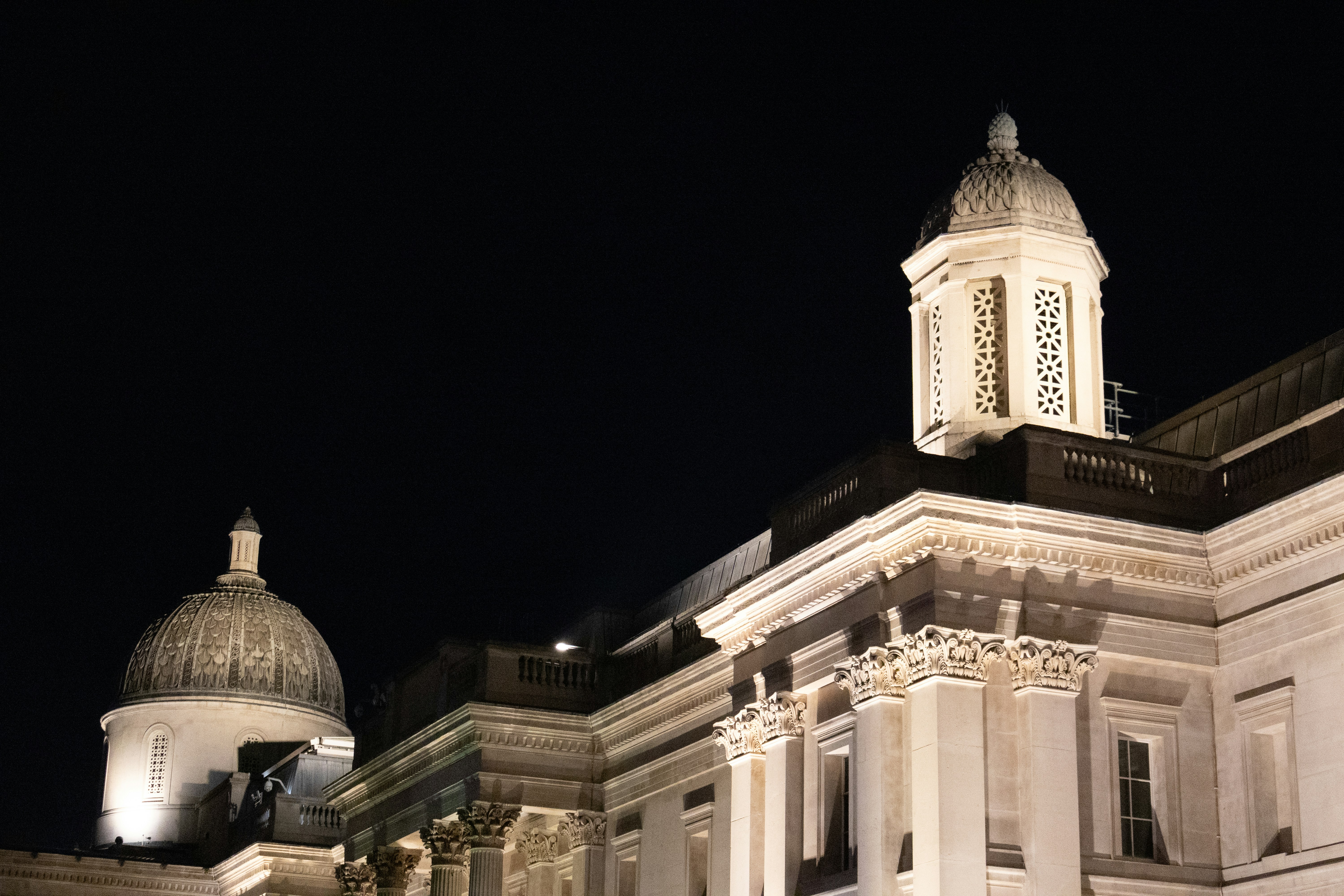 Night Lanterns on Marble: A Beaux-Arts Dome and Cupola in Focus