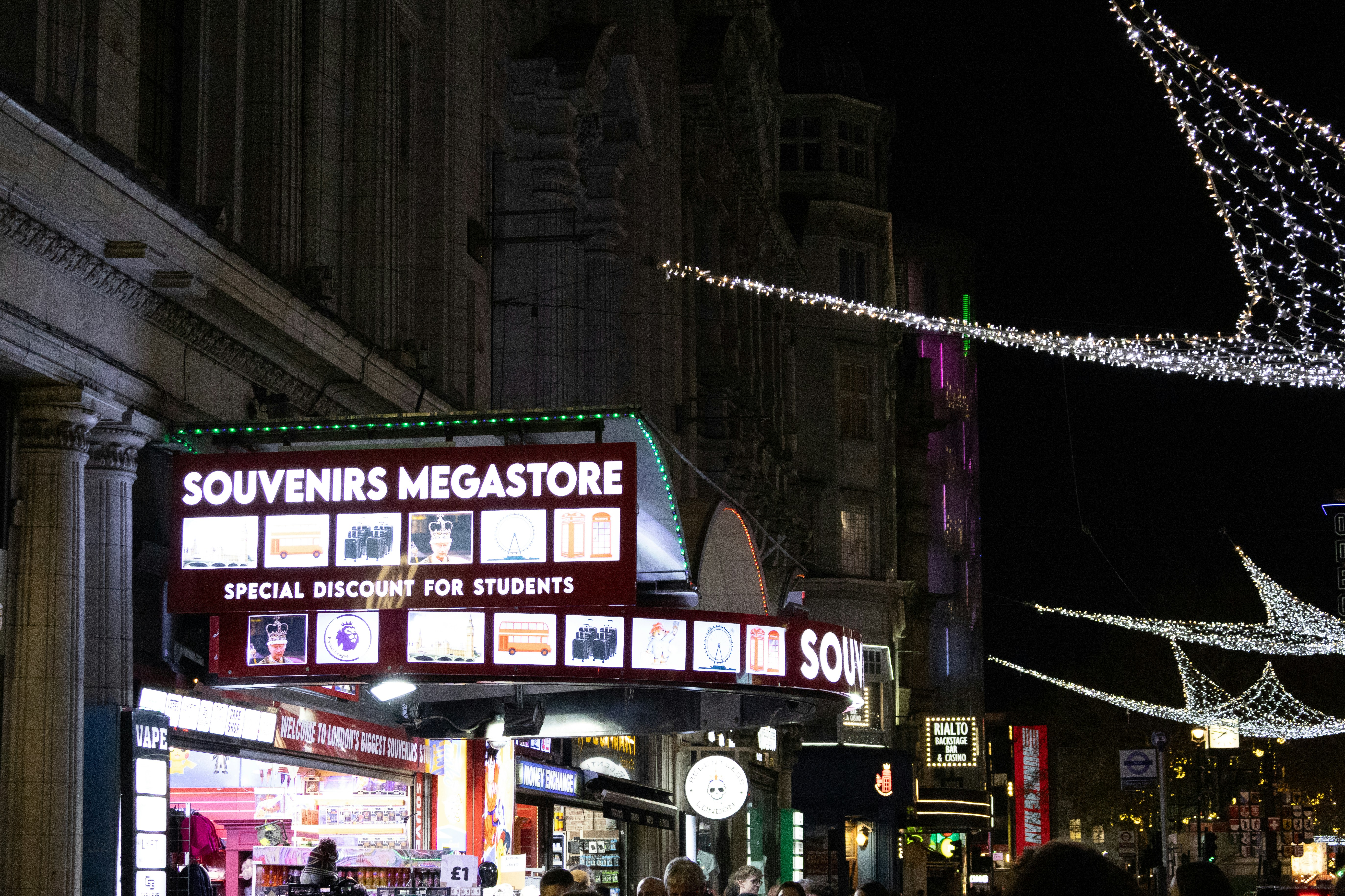 Neon Bazaar at Night: Souvenirs Megastore under Festooned Lights