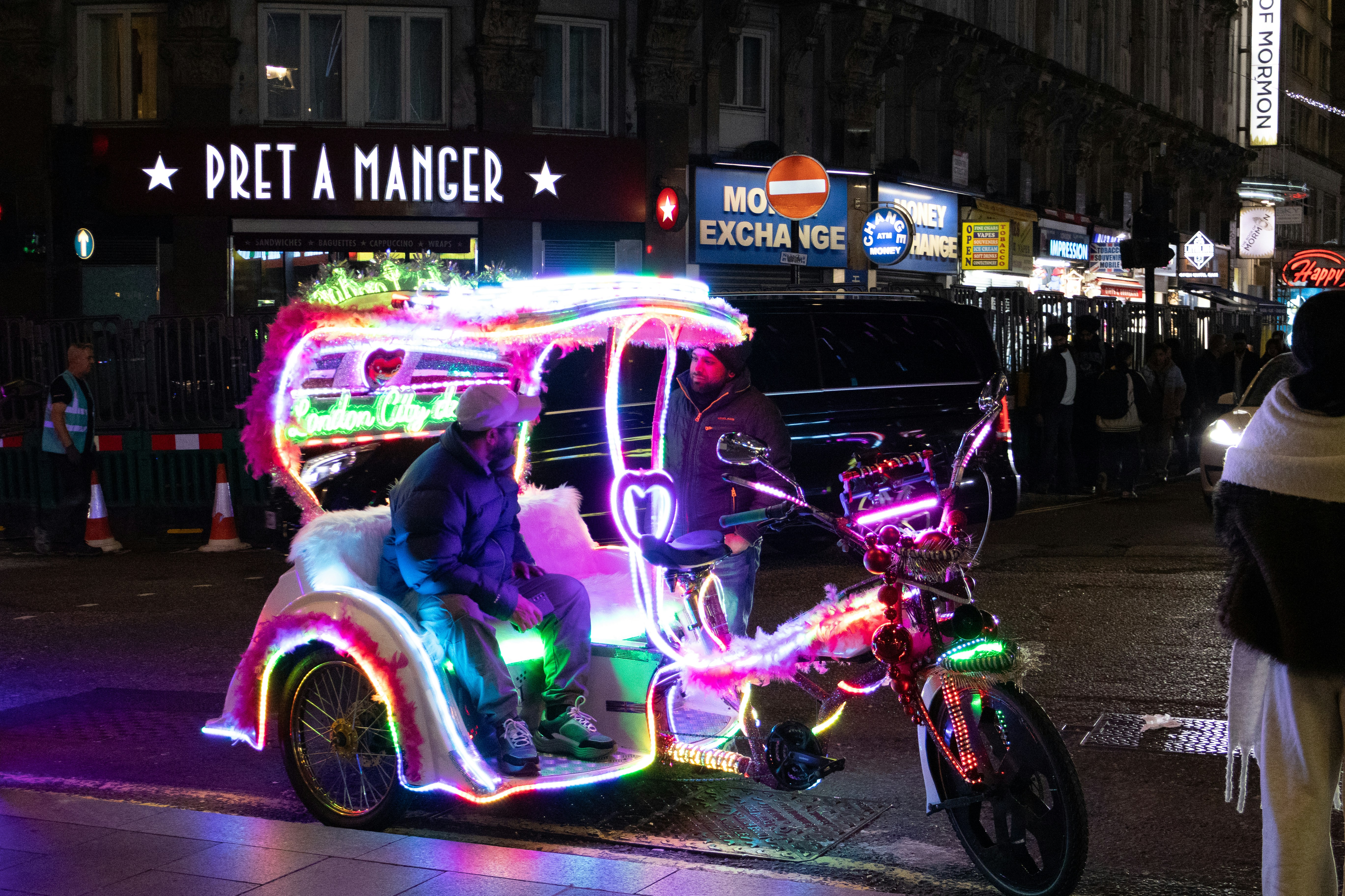 Chromatic Rickshaw in Night Urban Glow
