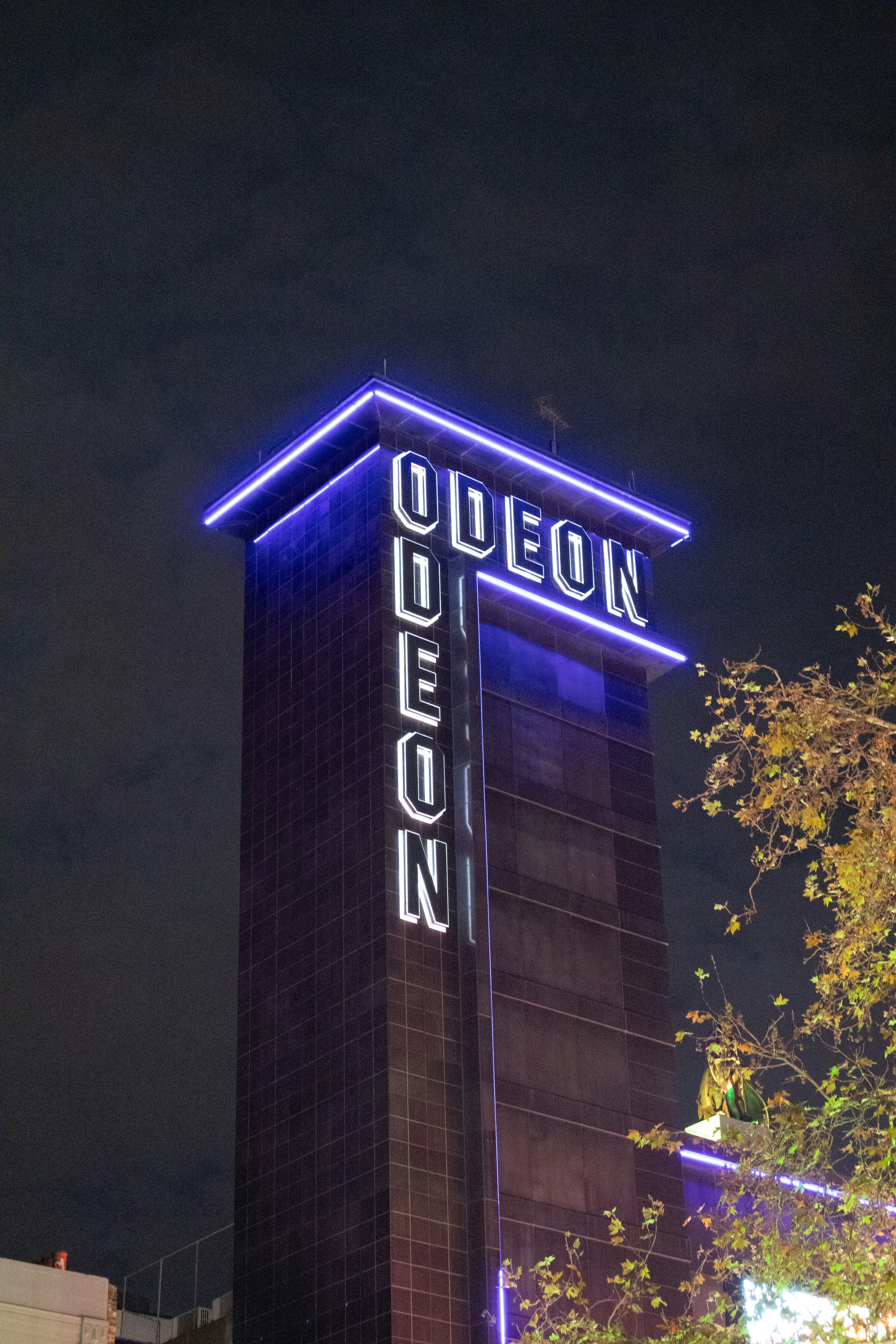 Odeon cinema tower illuminated at night photo – Free Architecture Image ...