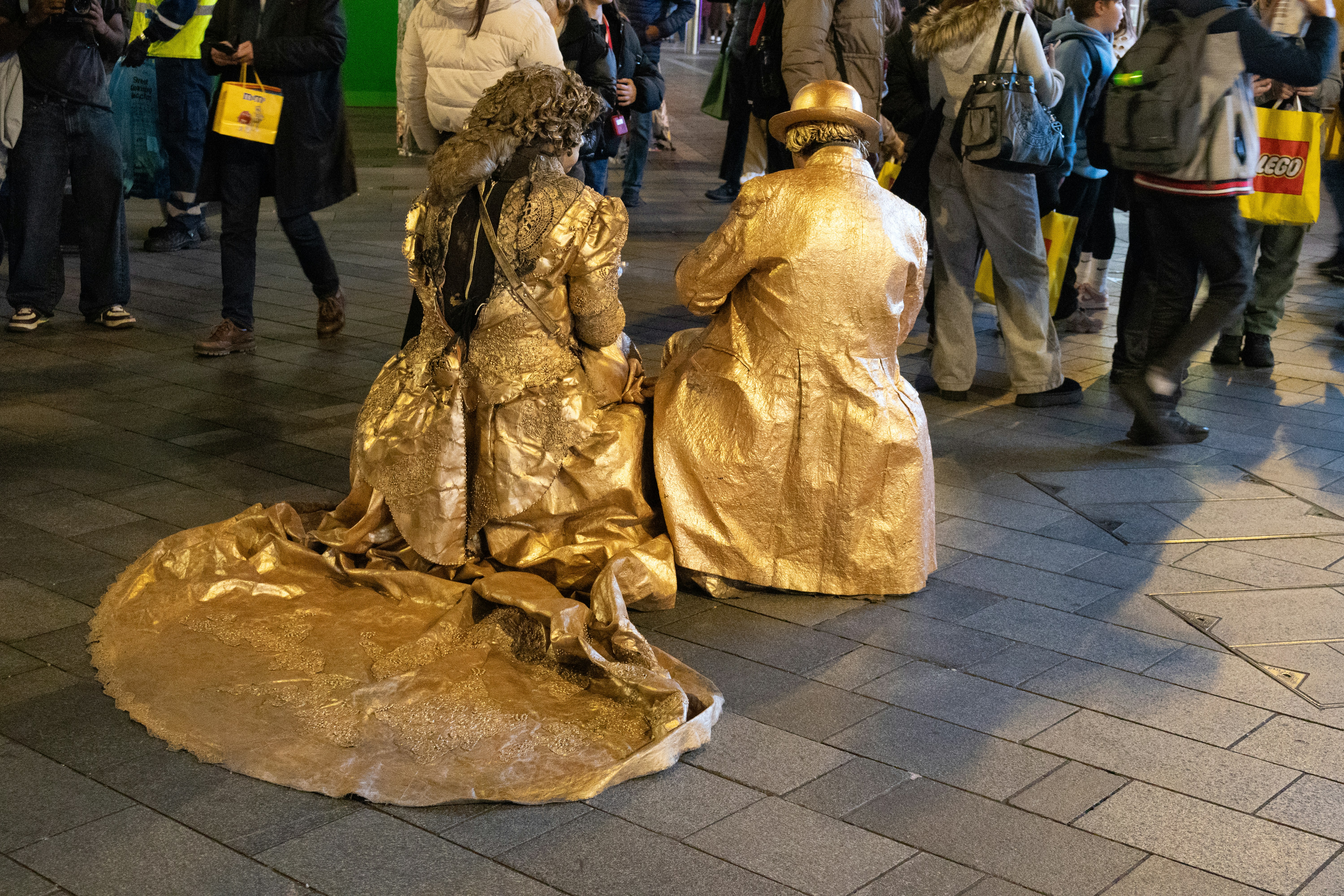 Golden Attire in a City Square