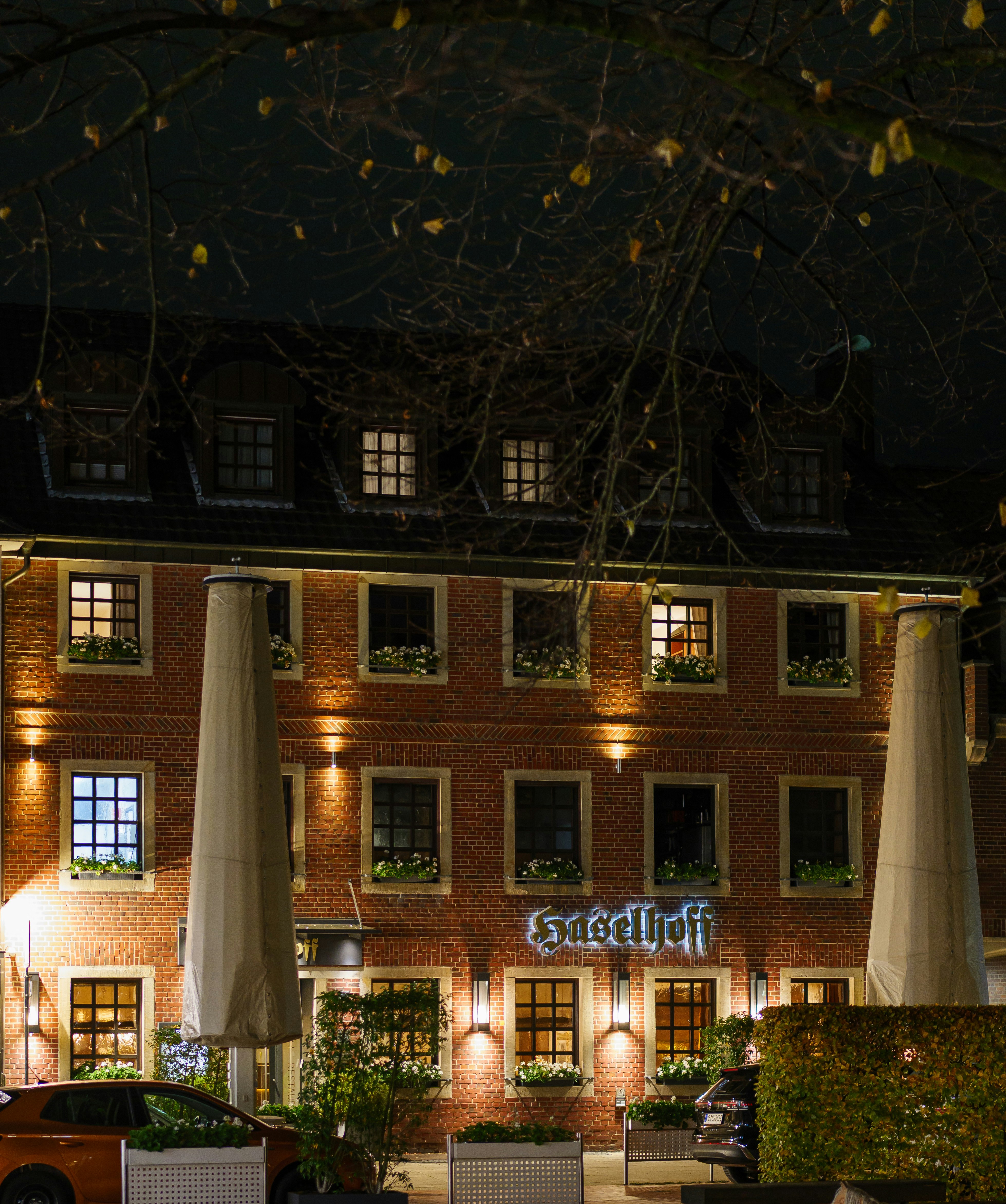 Gasthof Glow: Night Portrait of a Brick Inn Framed by Soft Street Light