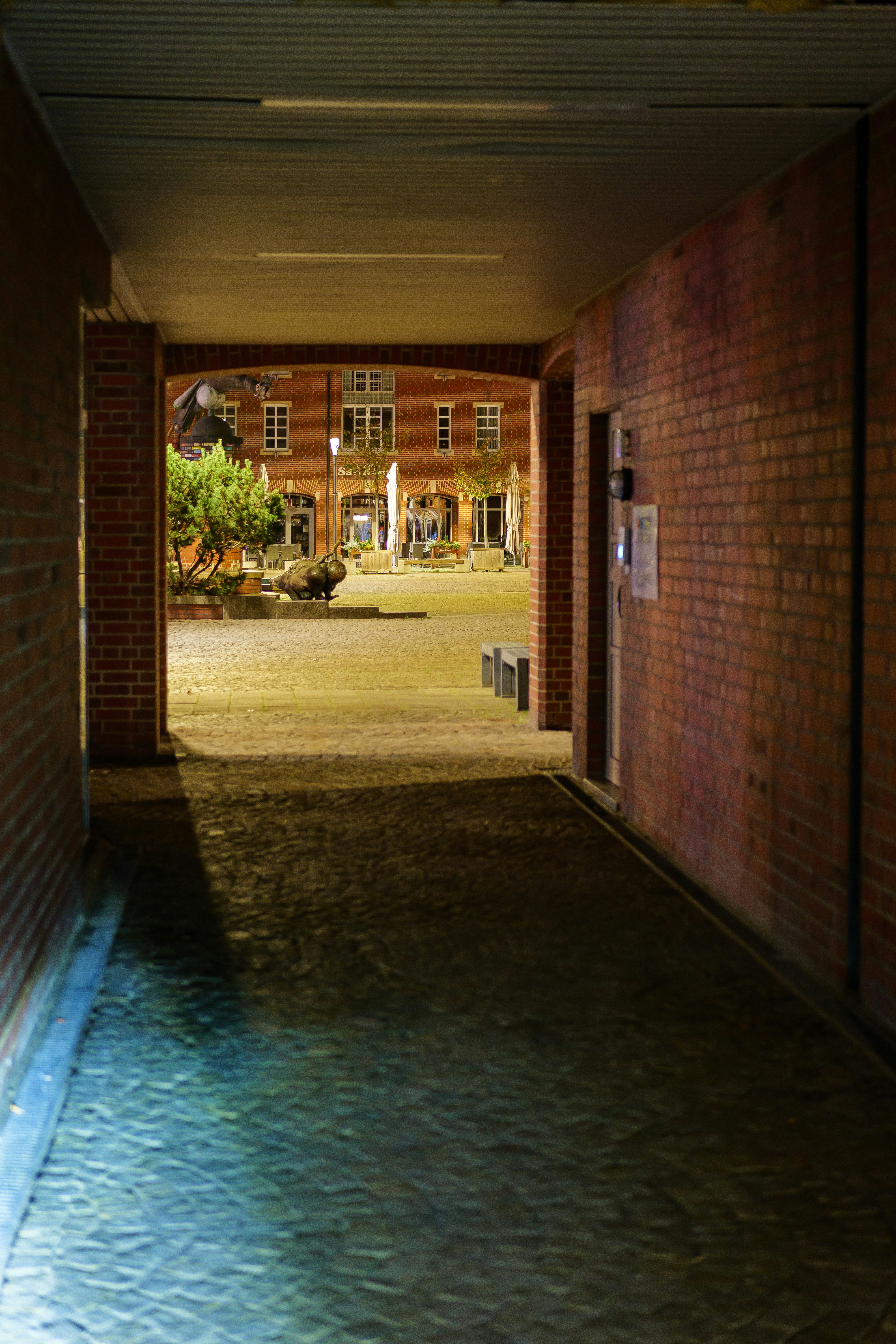 Brick Corridor to a Lanterned Town Square
