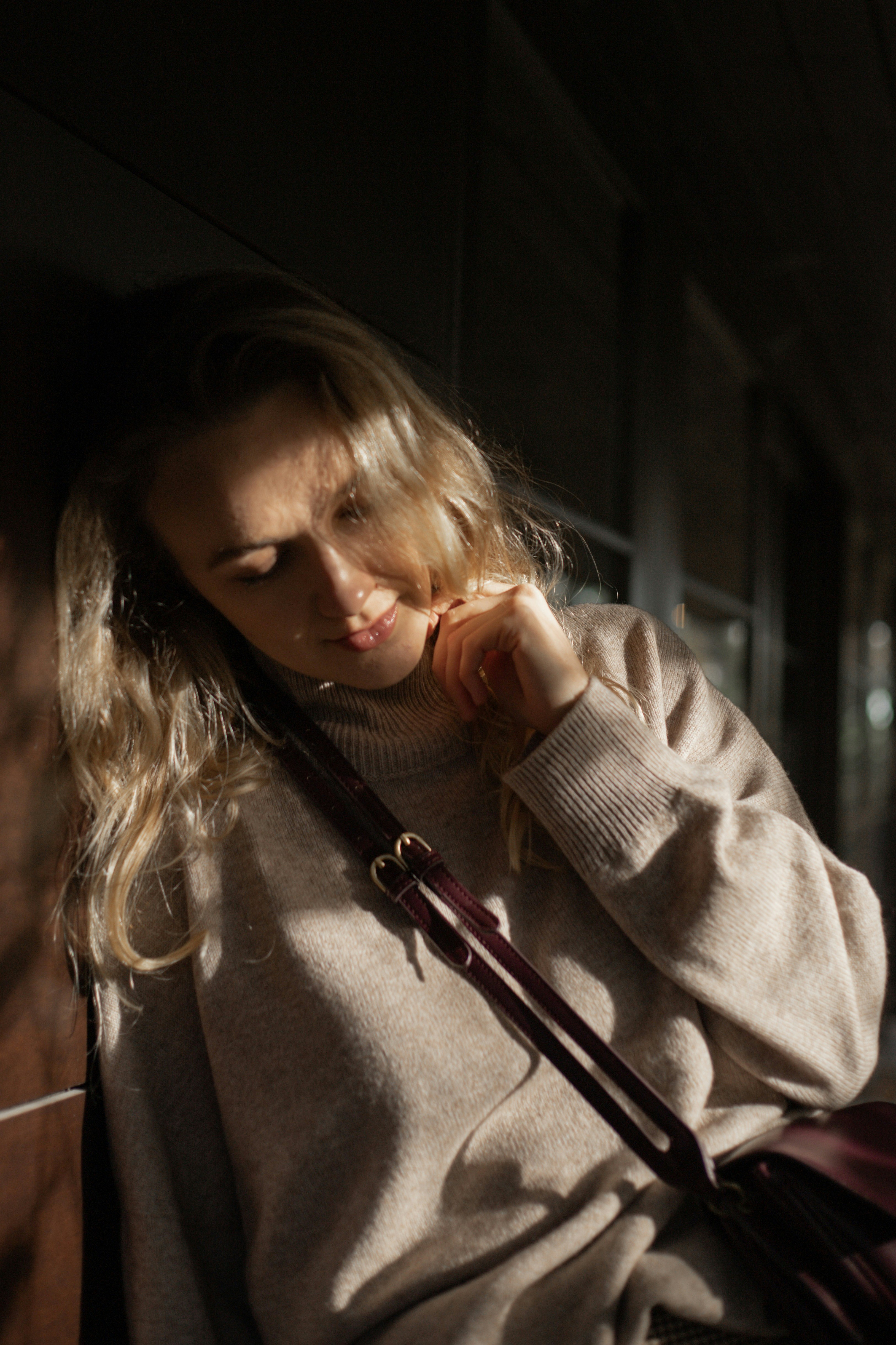 Golden Quiet: Portrait in a Sunlit Corridor
