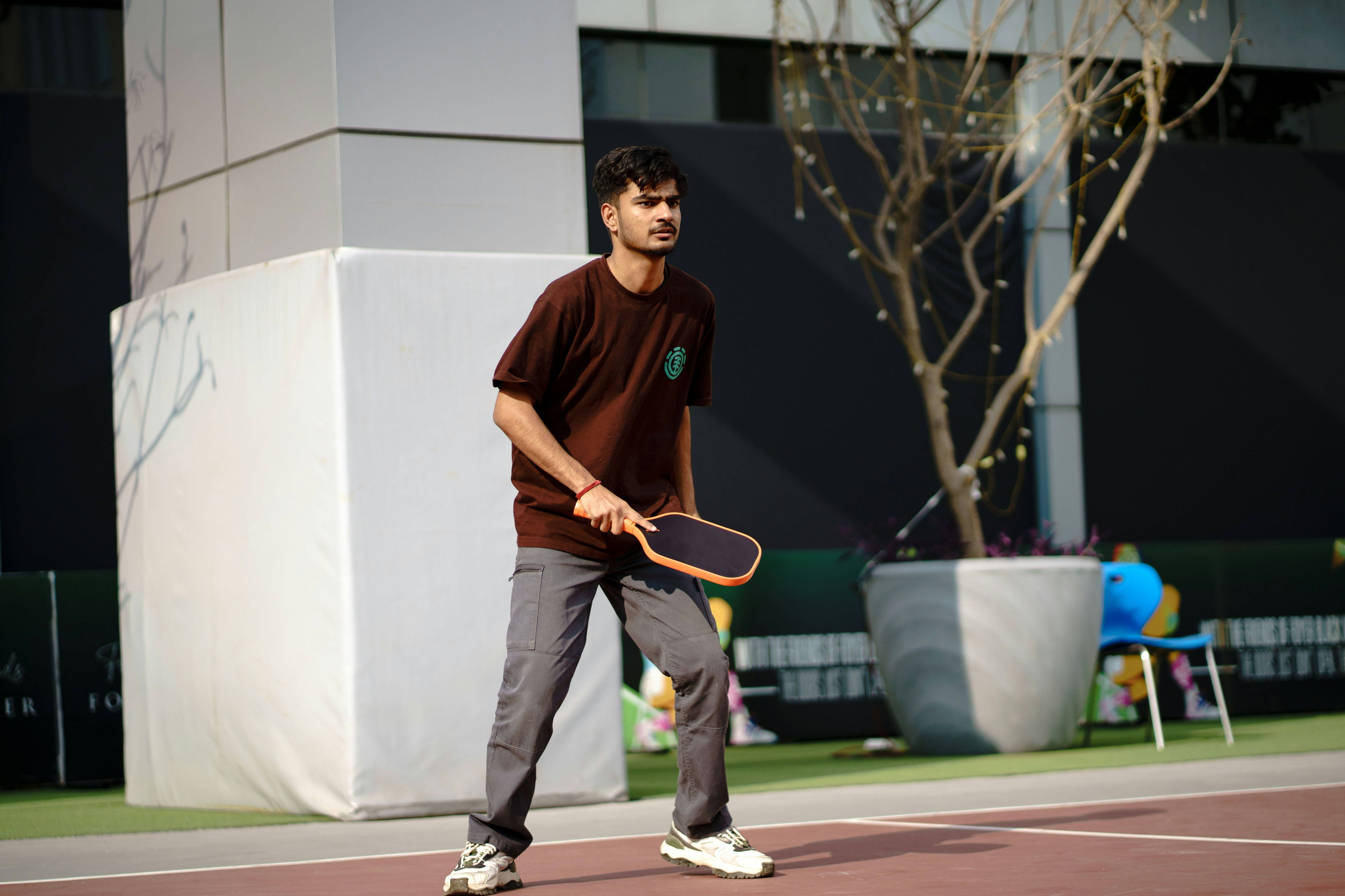 Young man playing paddle tennis outdoors photo – Free Fitness Image on ...