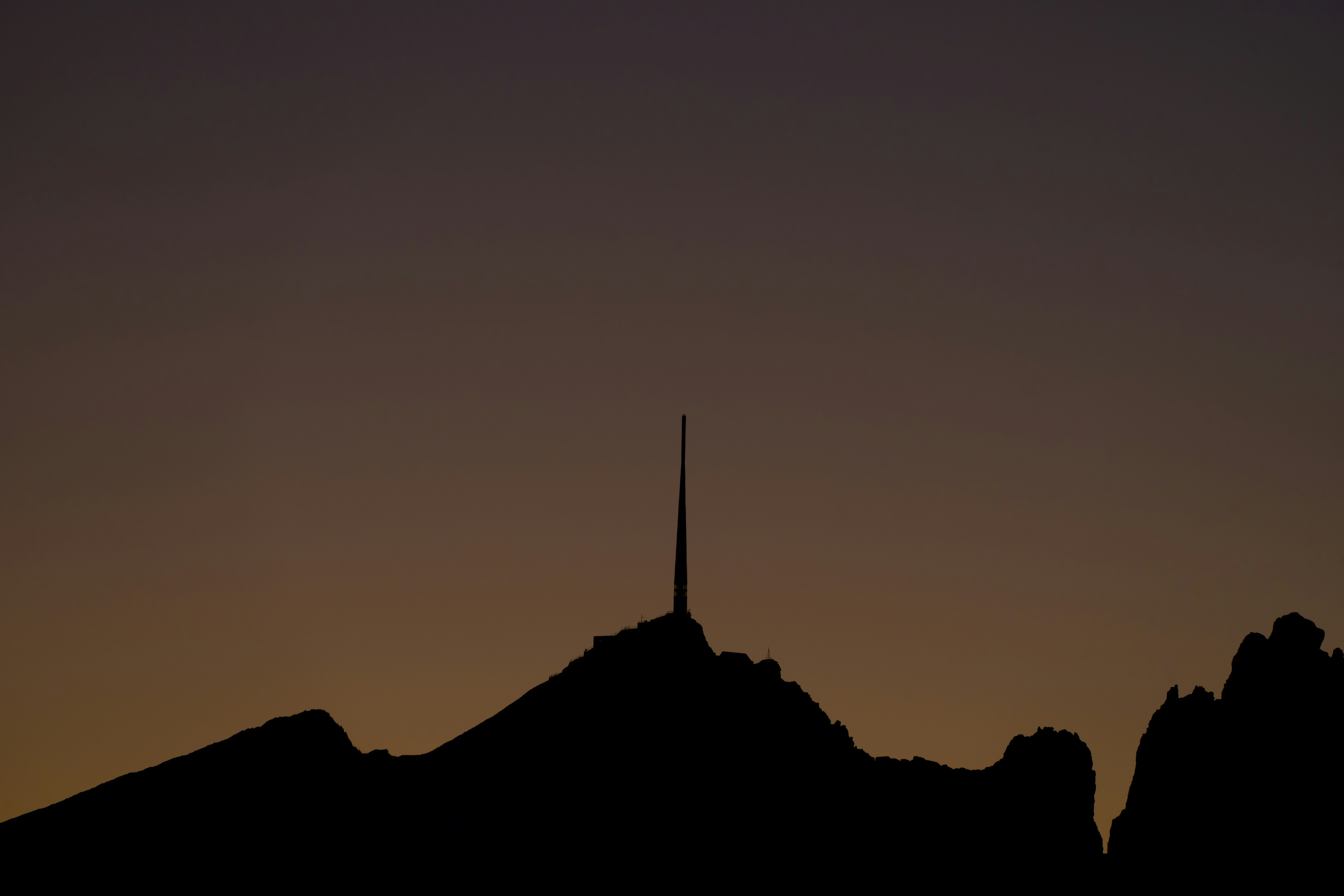 Evening Spire: A Lone Pinnacle at Dusk Ridge