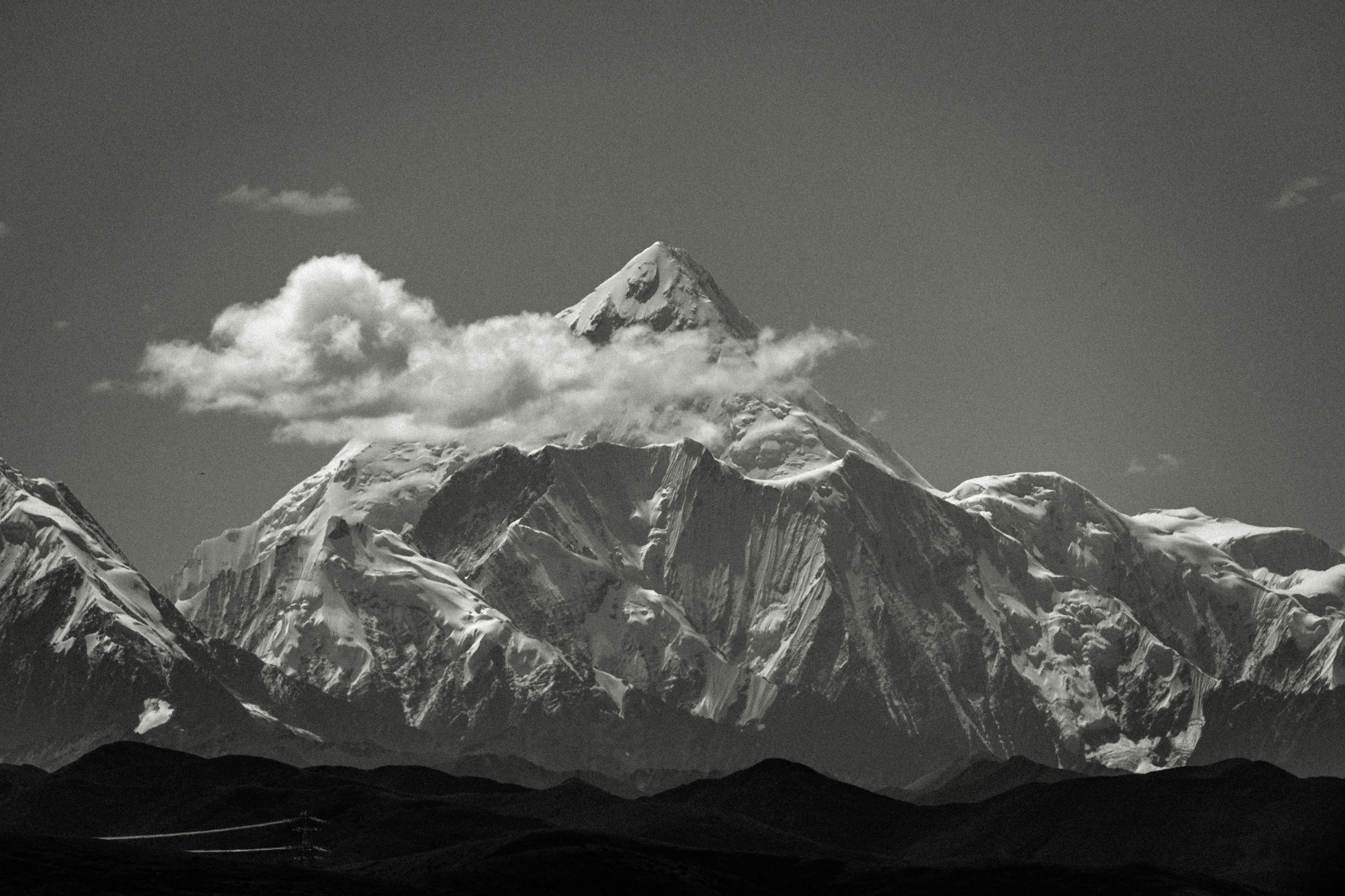 Monochrome Sentinel: Pyramid Peak Rises Over a Shadowed Alpine Rim