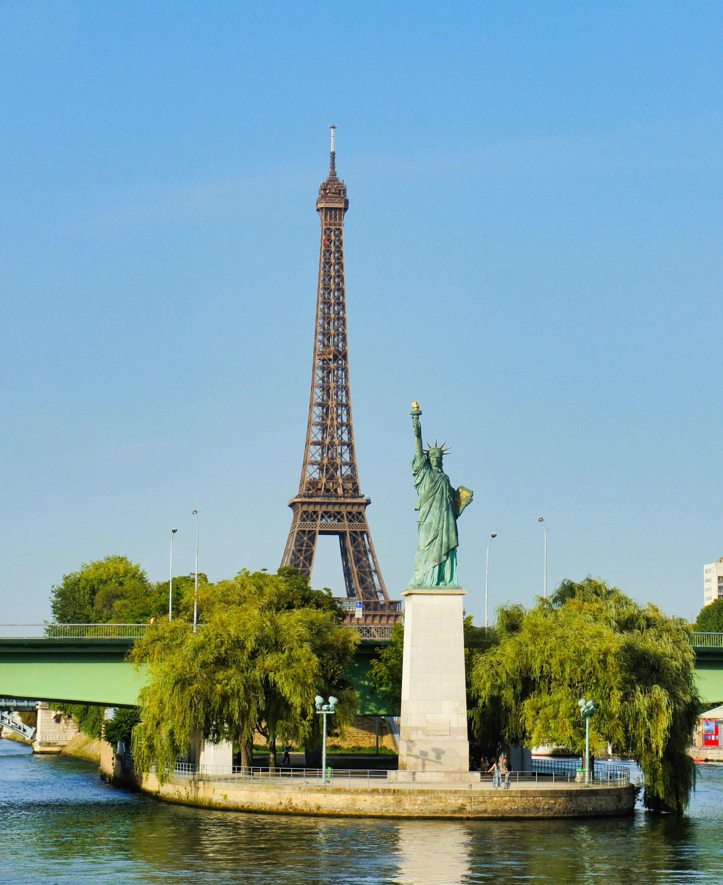 Seine Skyline: Eiffel Tower Framed by the Liberty Statue on Île aux Cygnes