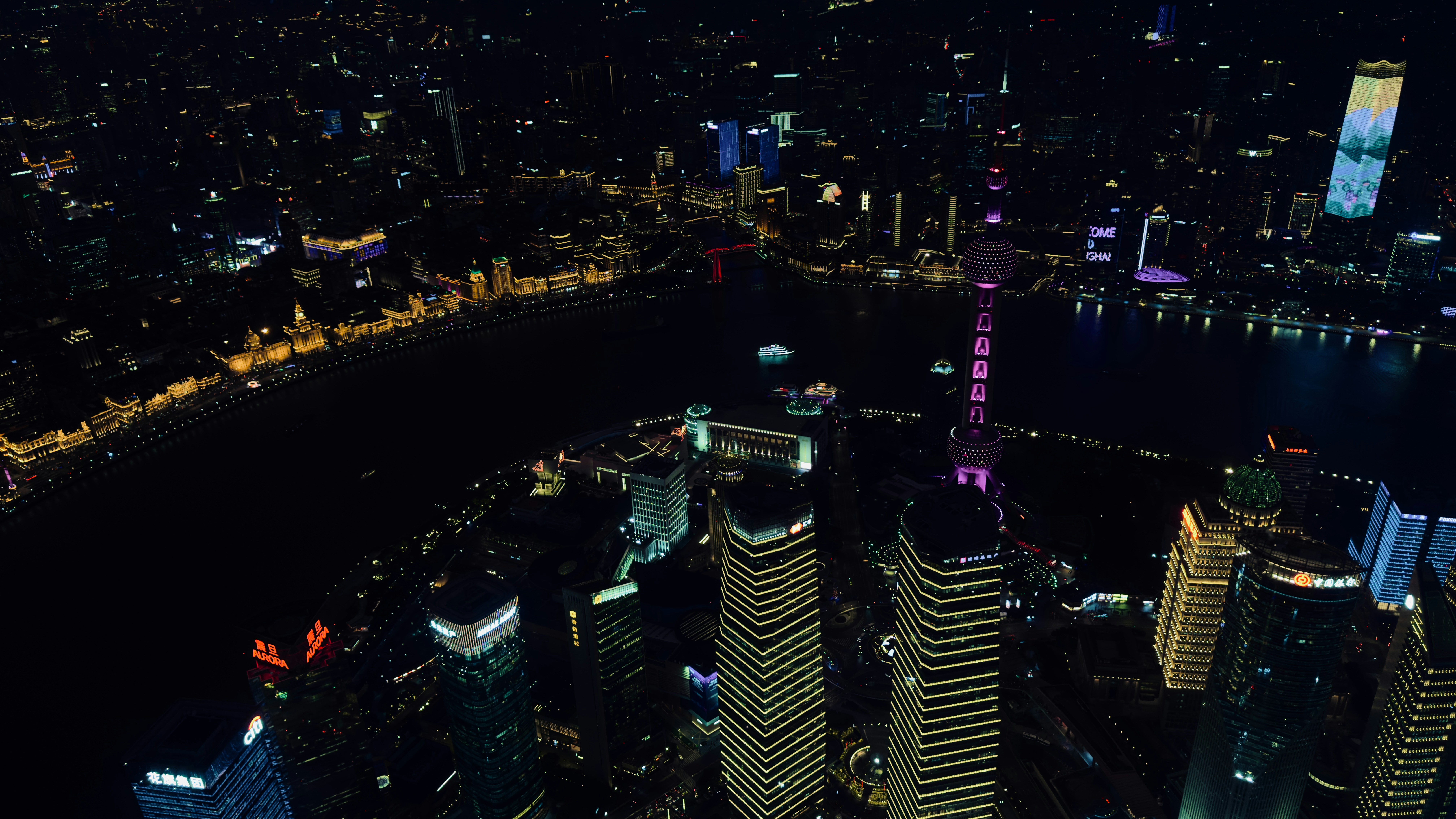 Neon Spire Over the River: Night Skyline Bathed in Violet Light