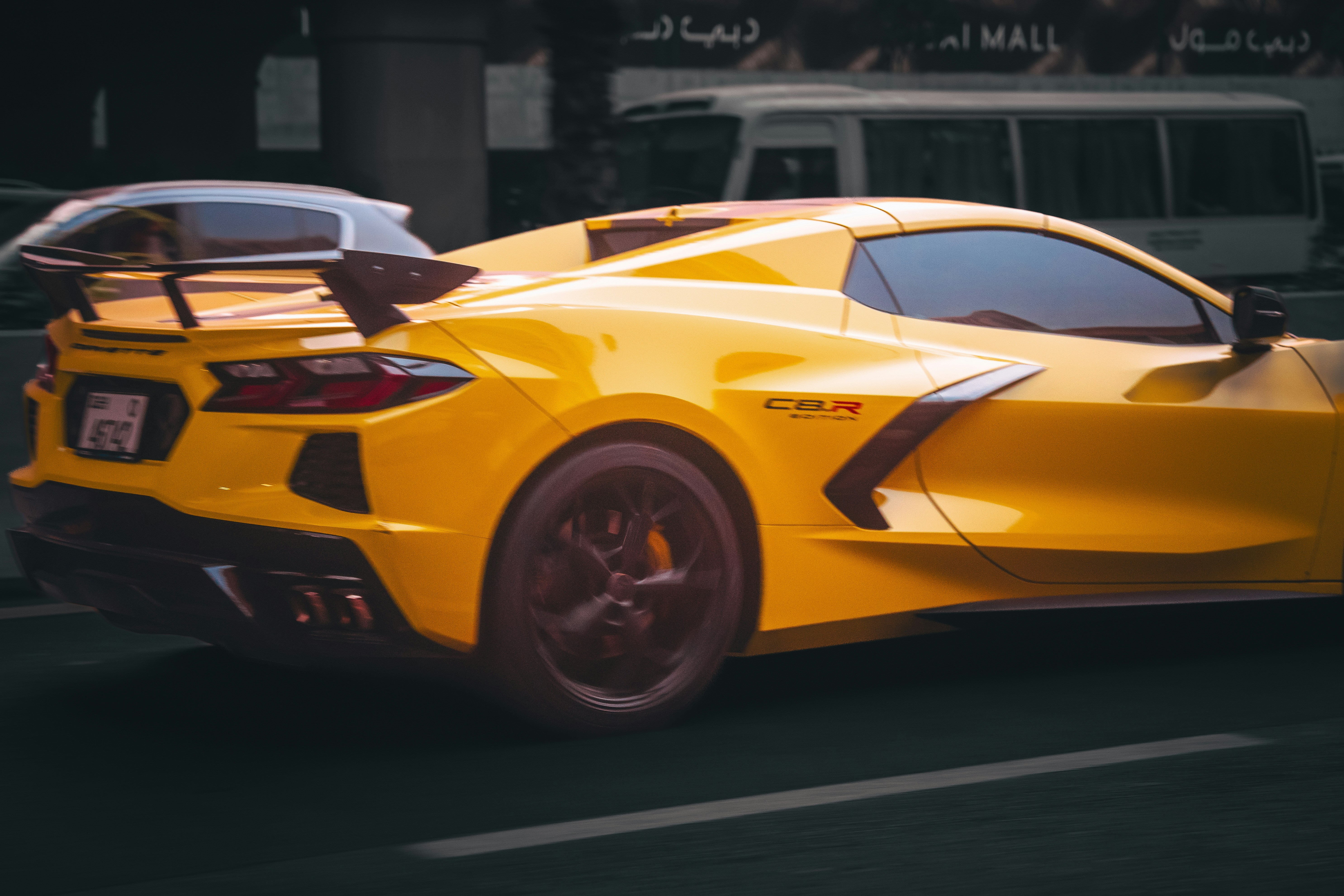 Urban Blur in Yellow: Corvette Surges Through the City Streets