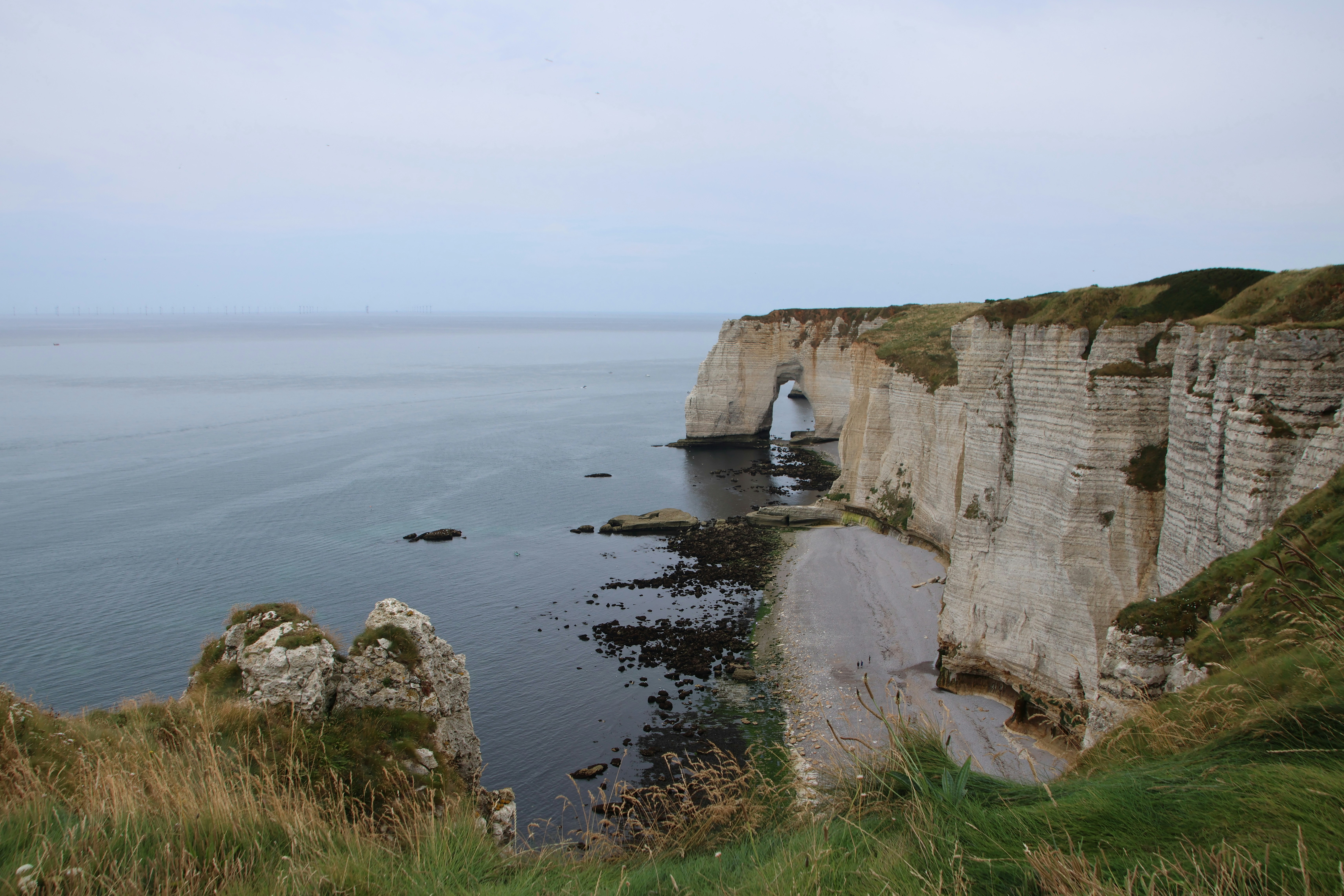 Sea Arch at the Edge: White Chalk Cliffs and Quiet Sea