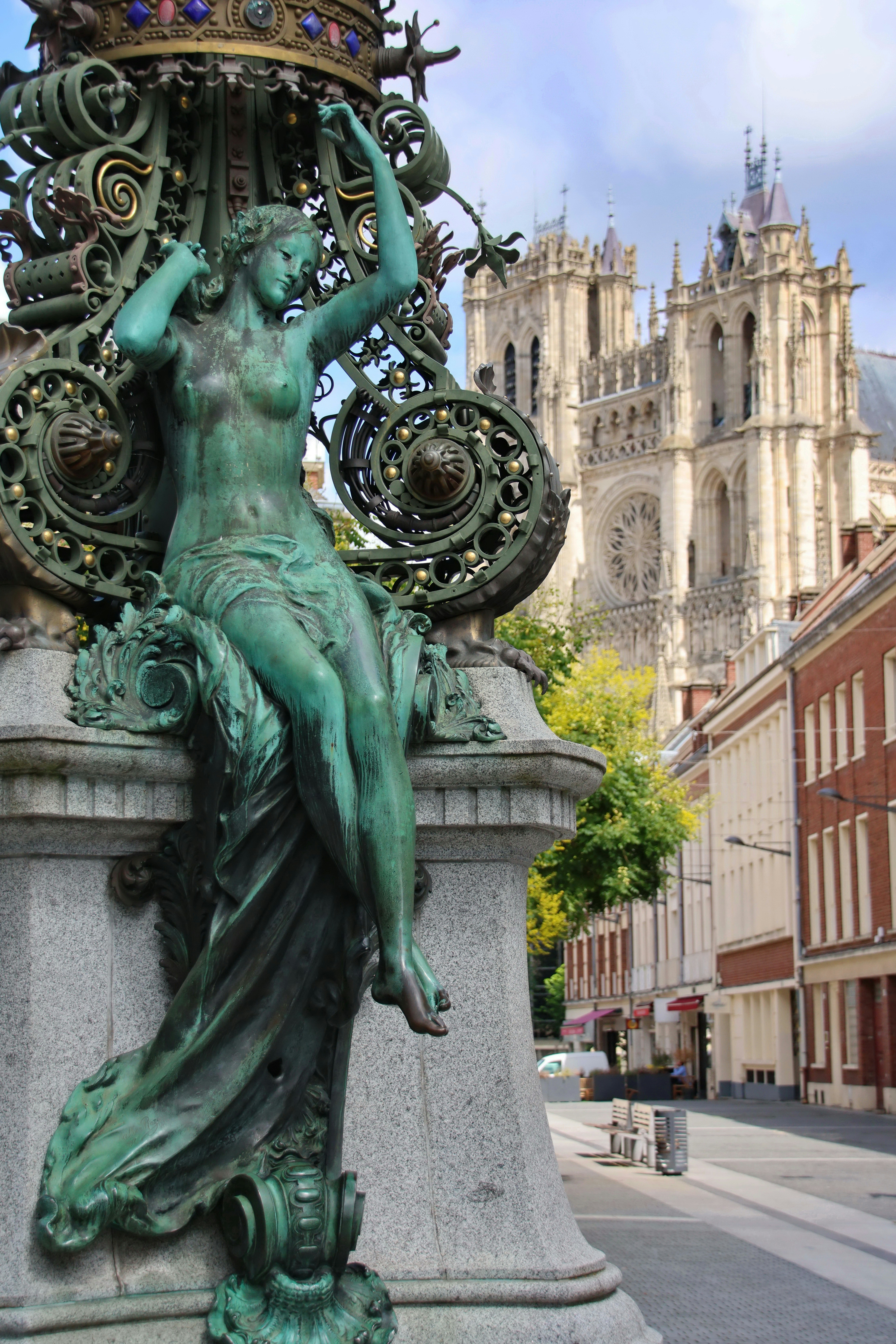 Patina-Green Nymph on an Ornate Fountain, Notre-Dame Framing the Scene